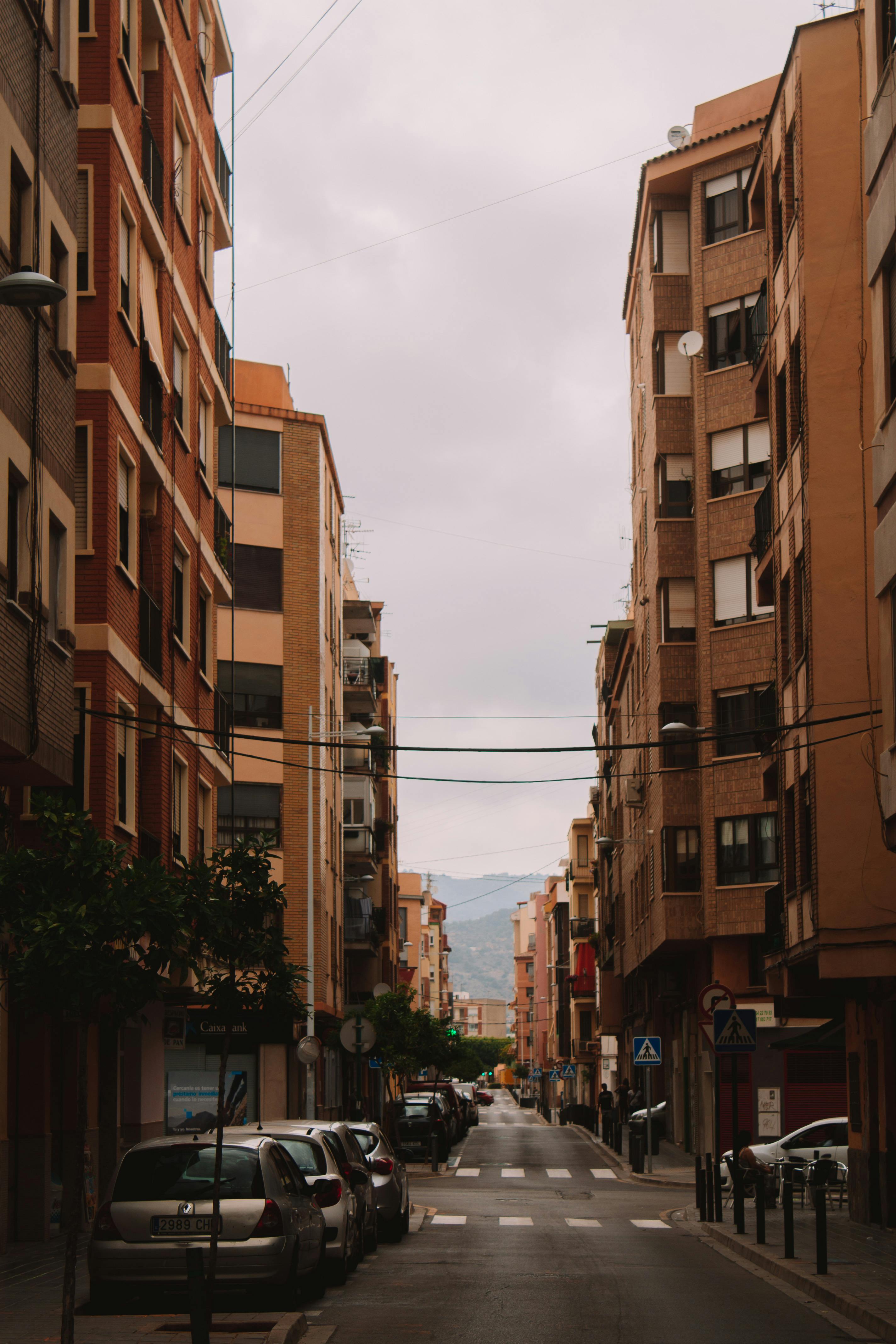 Cars Parked Along Calm Street in City · Free Stock Photo