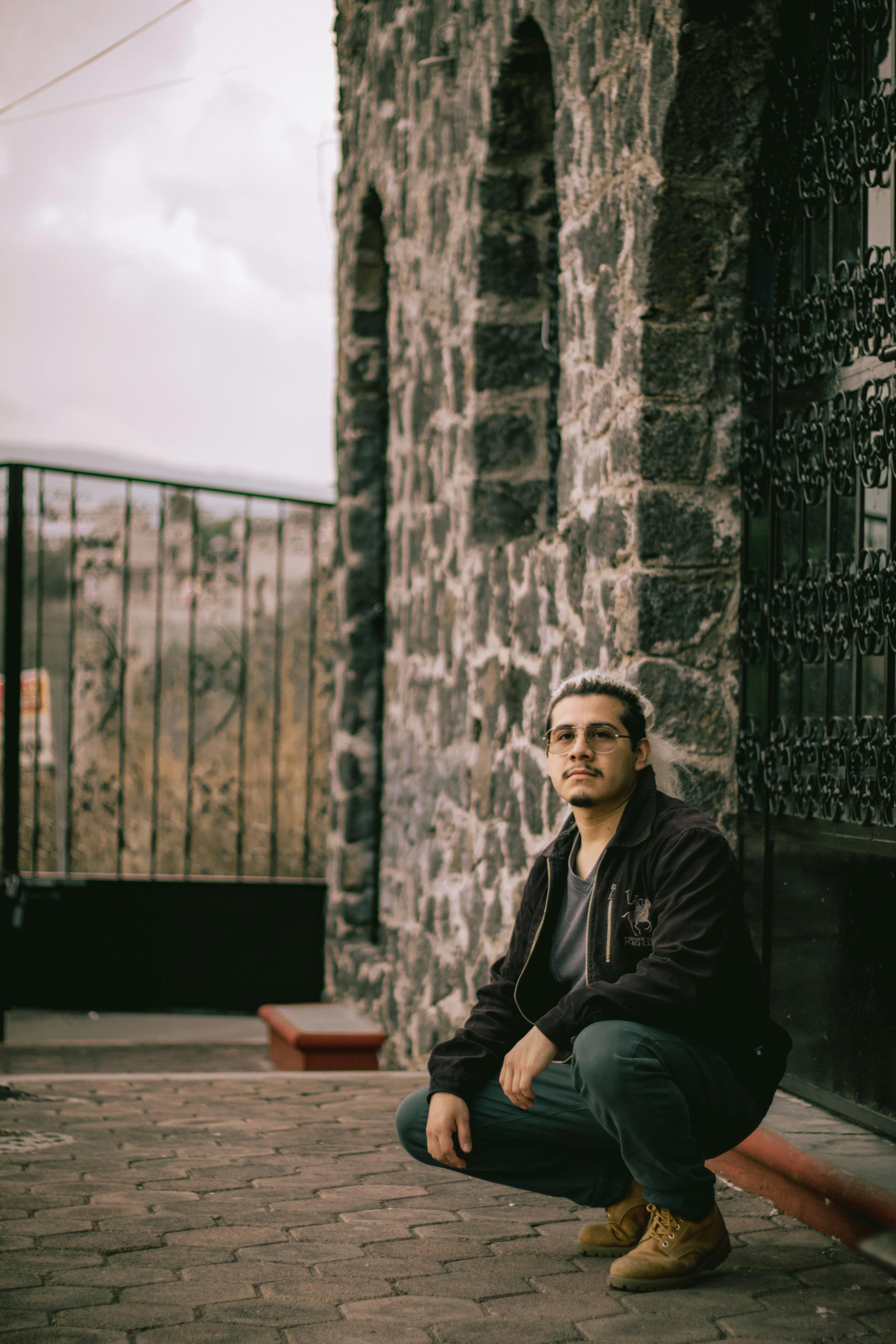 Man Standing in Front of an Arch in a Fortress · Free Stock Photo