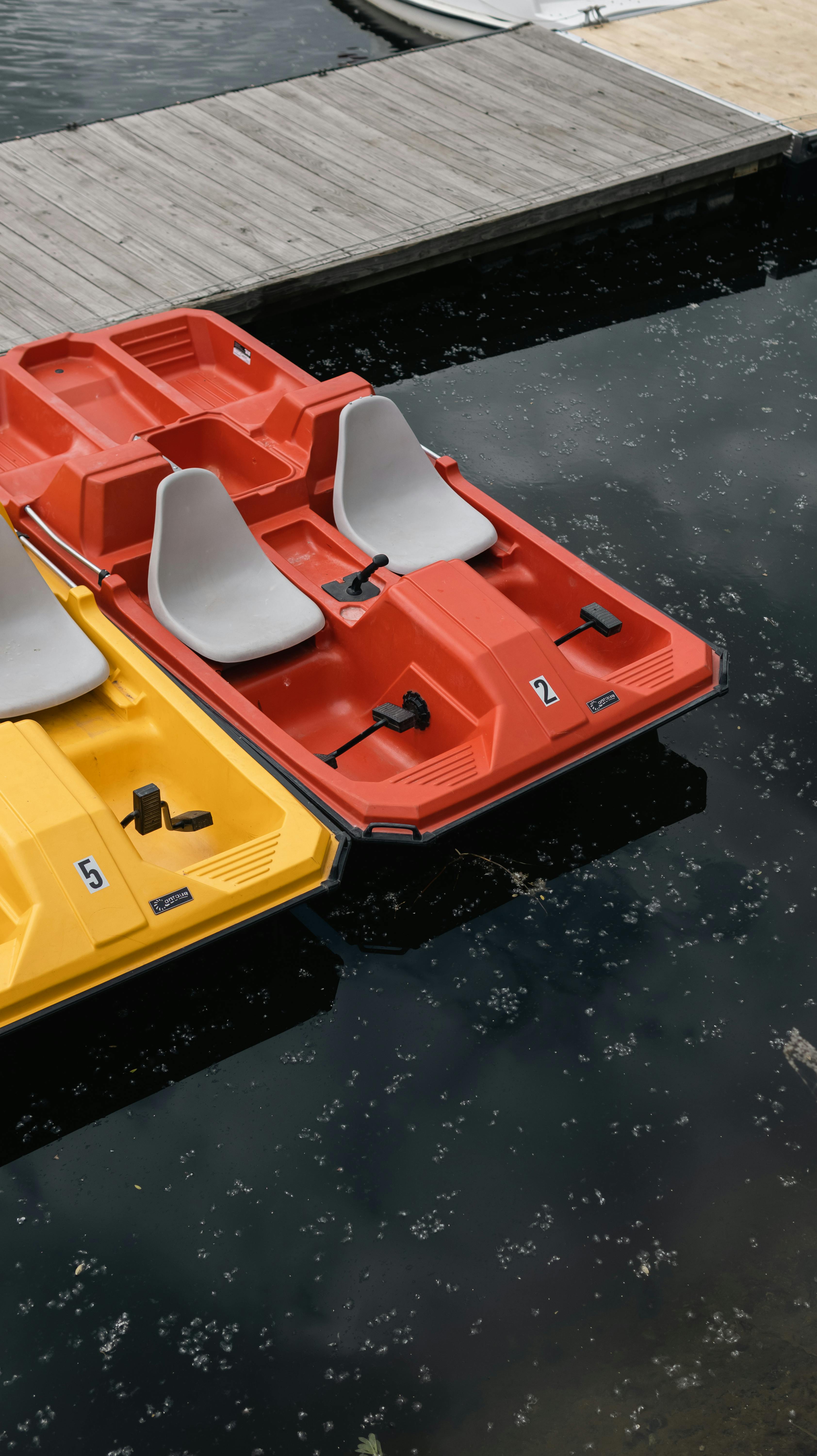Yellow and Red Plastic Boats Moored by a Jetty · Free Stock Photo