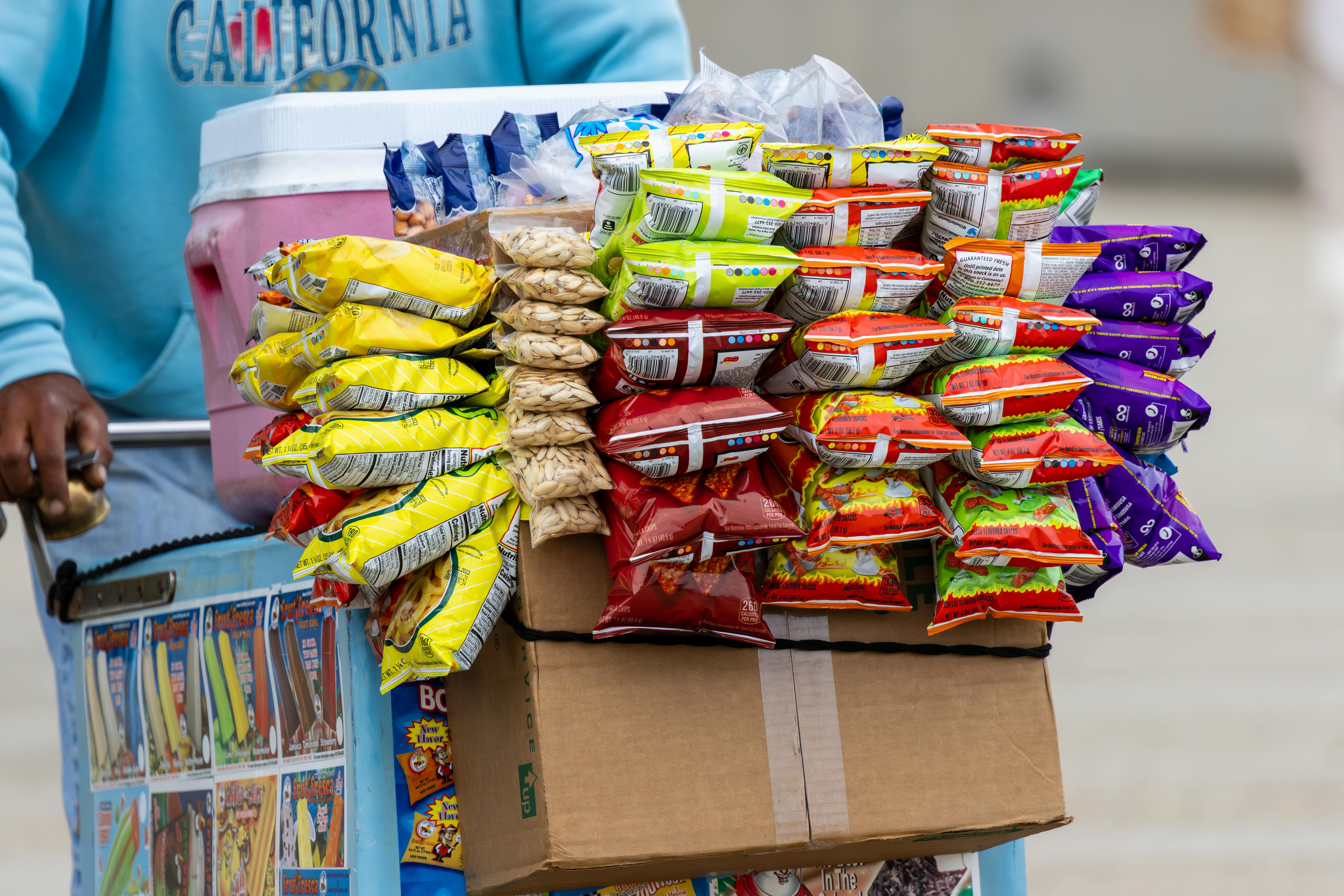 Person Carrying Packages with Snacks · Free Stock Photo