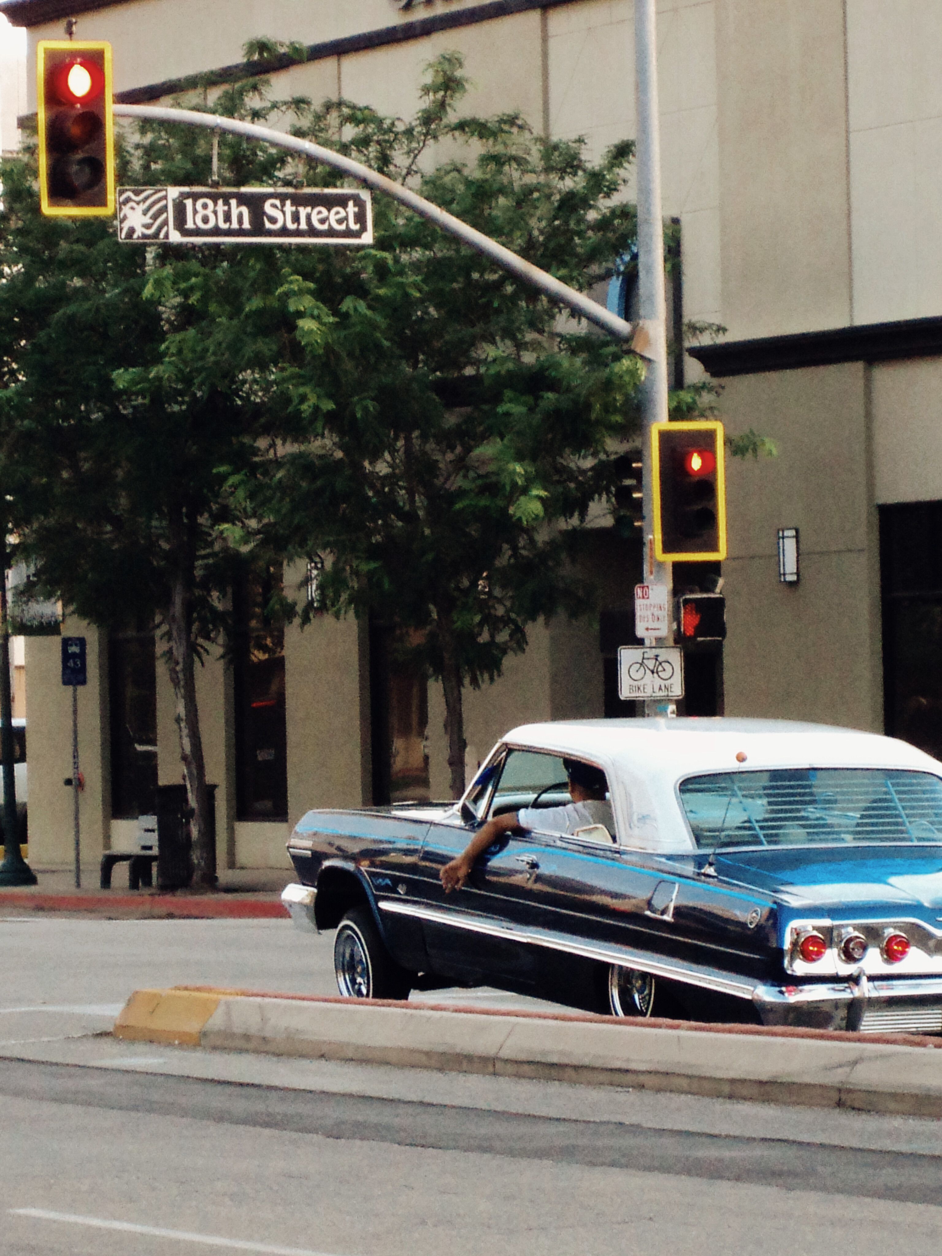 Chevrolet Impala Waiting for Green Light at Intersection · Free Stock Photo