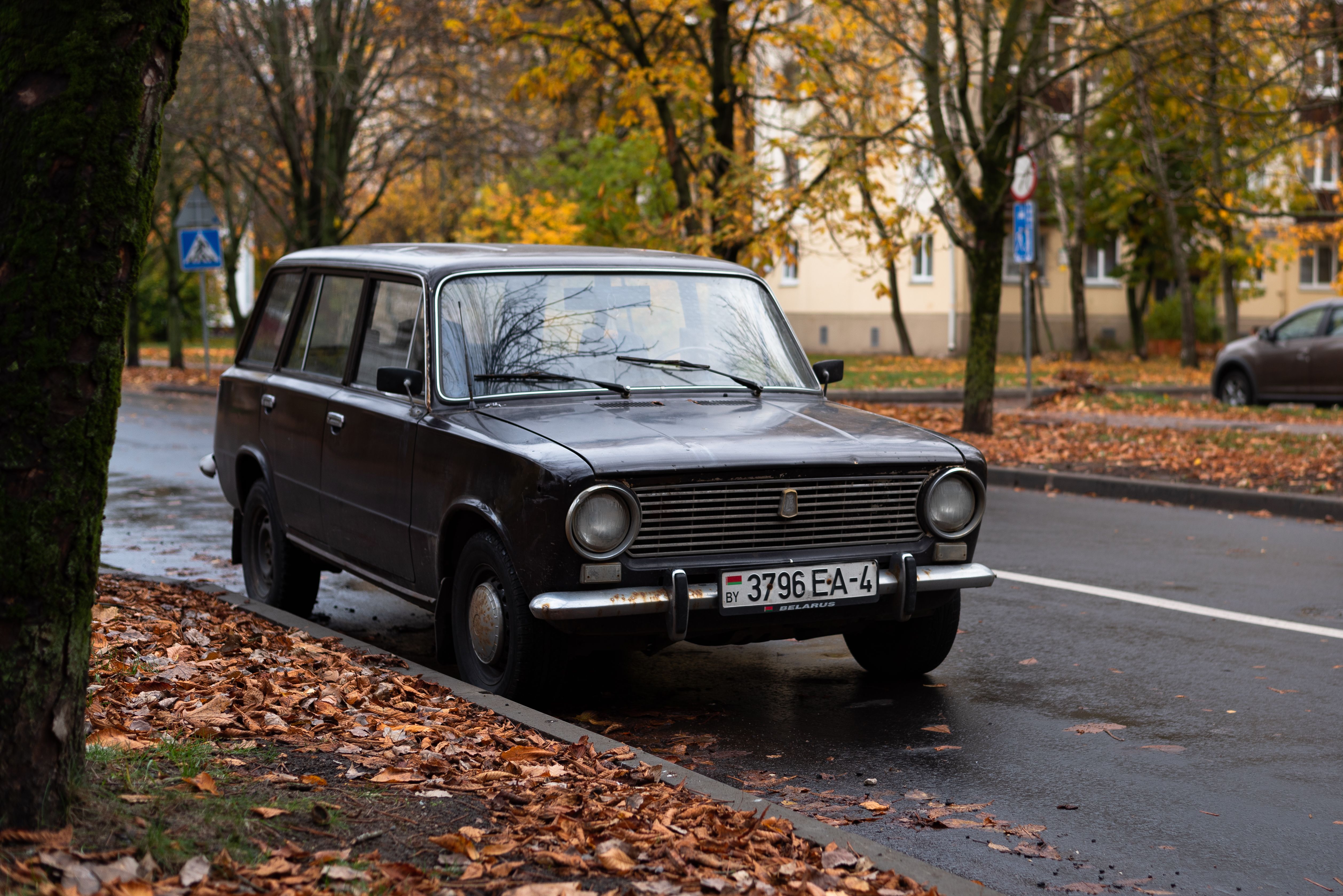 Black Lada Standing on Autumn Street · Free Stock Photo