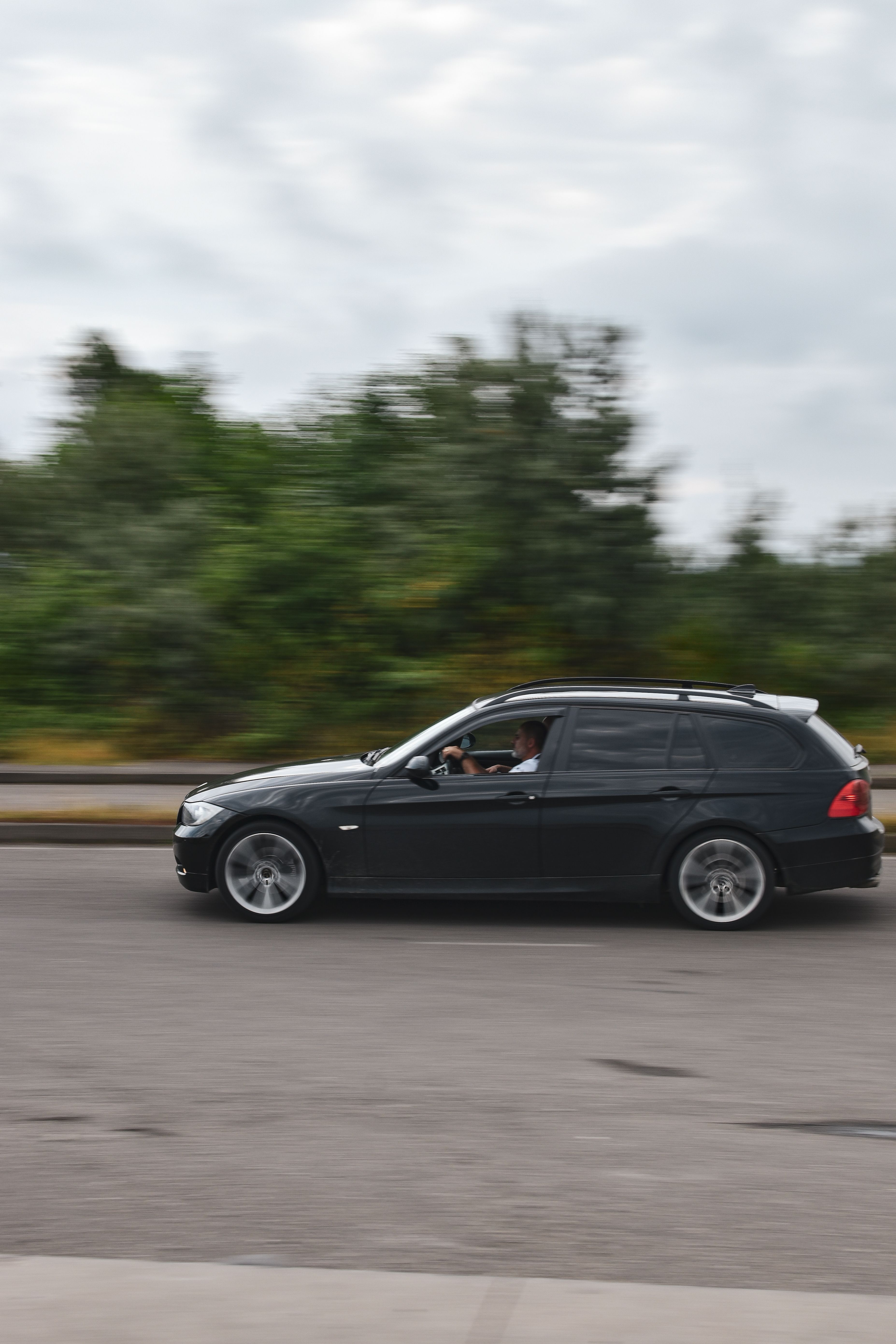 Driver in Car on Road · Free Stock Photo