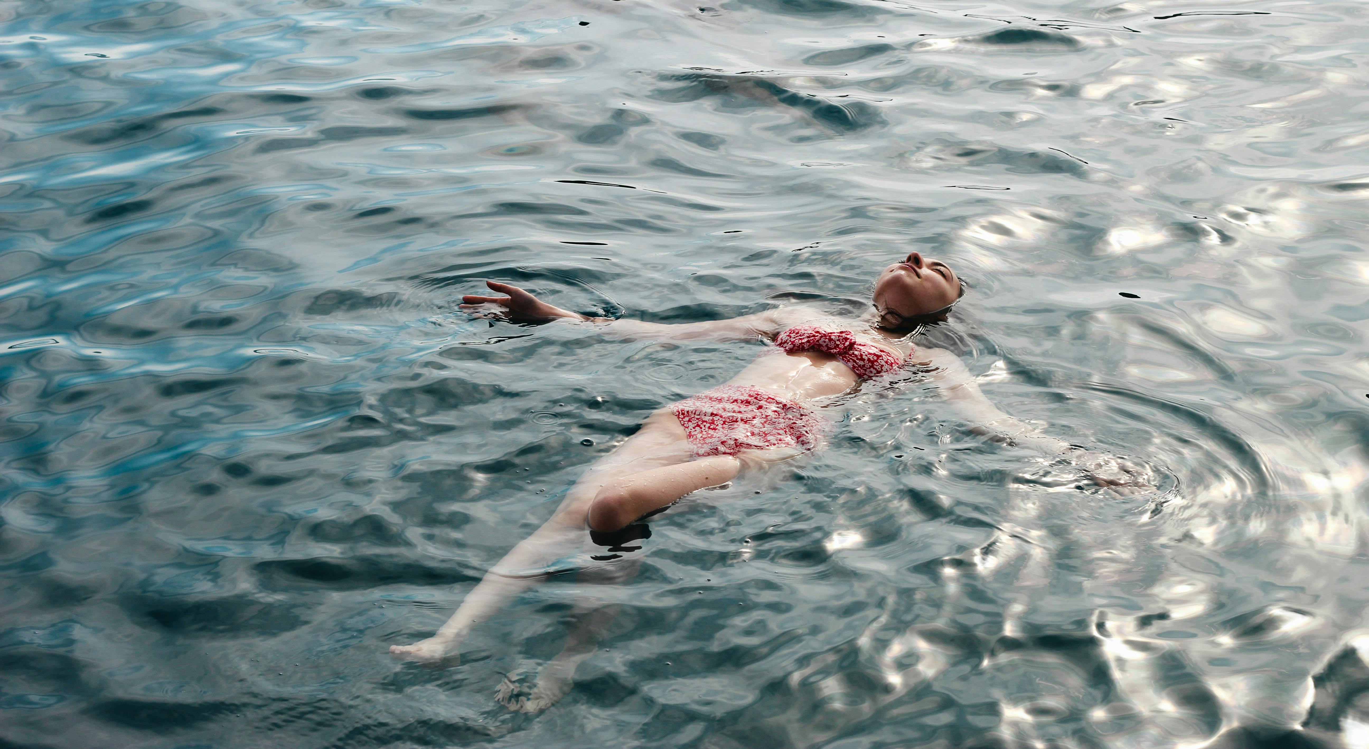 Top View Photo of Woman Floating on Water · Free Stock Photo