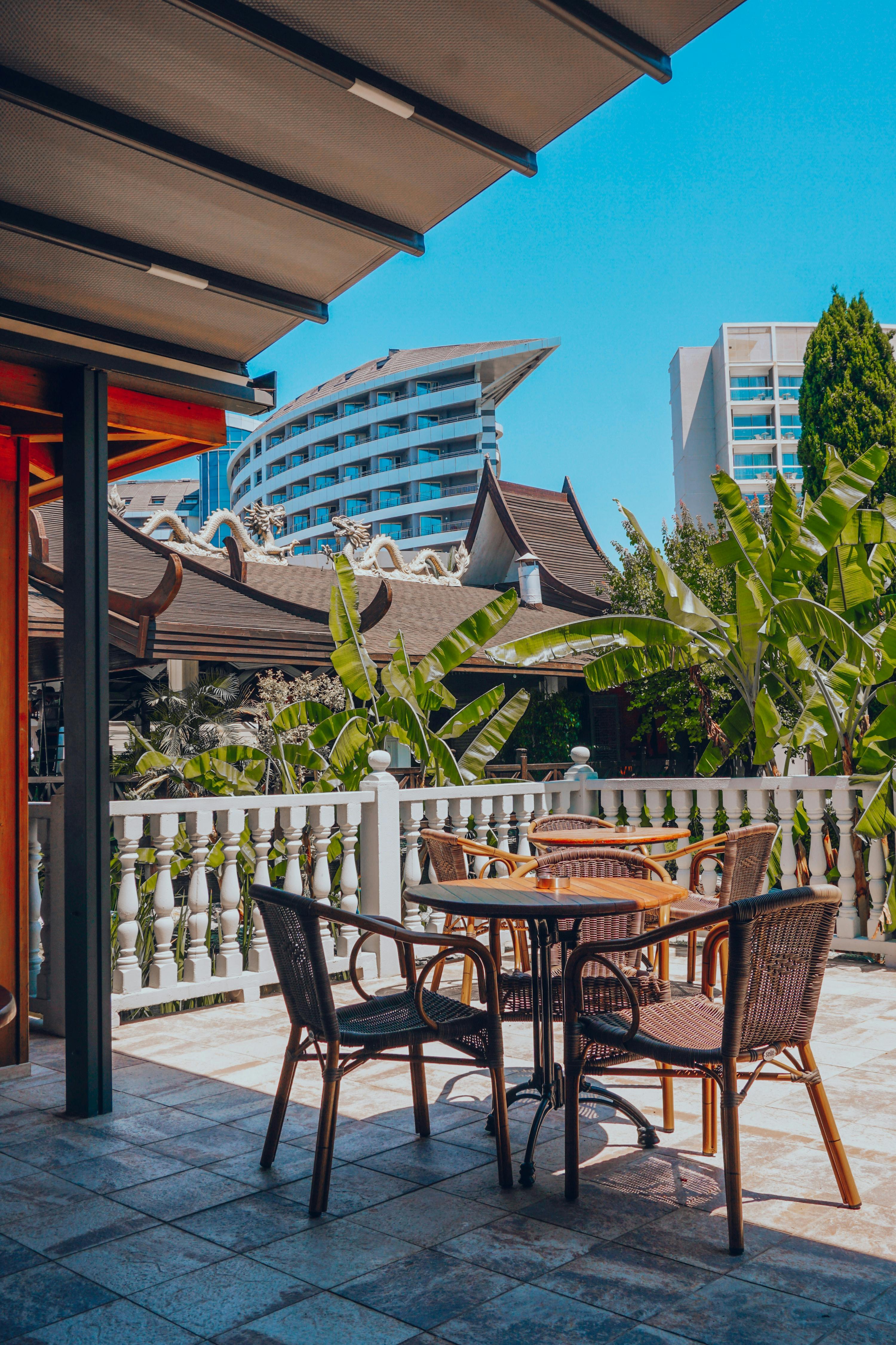 Cafe with outdoor tables in tropical resort · Free Stock Photo