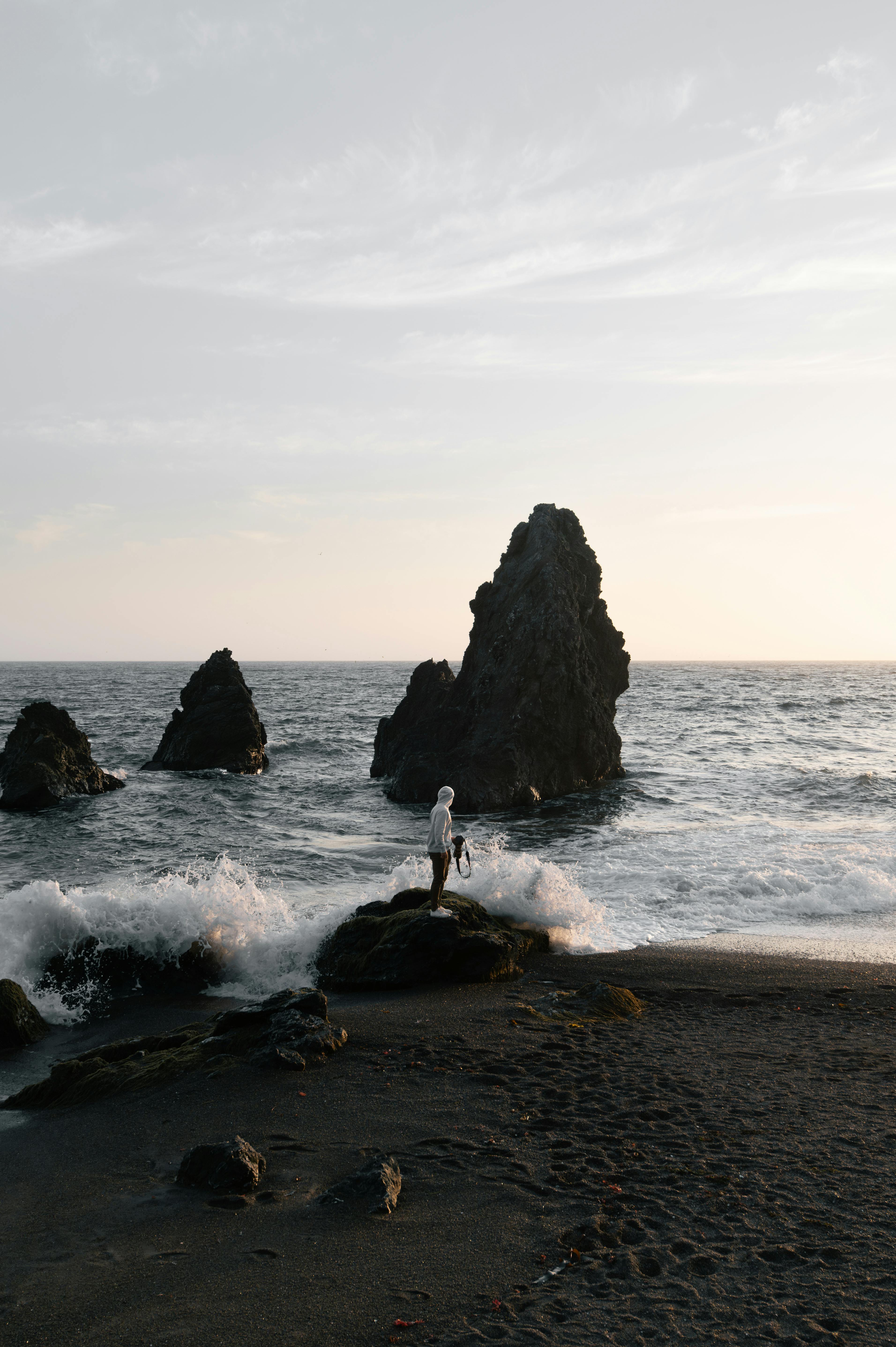 Person on Beach Watching Waves · Free Stock Photo