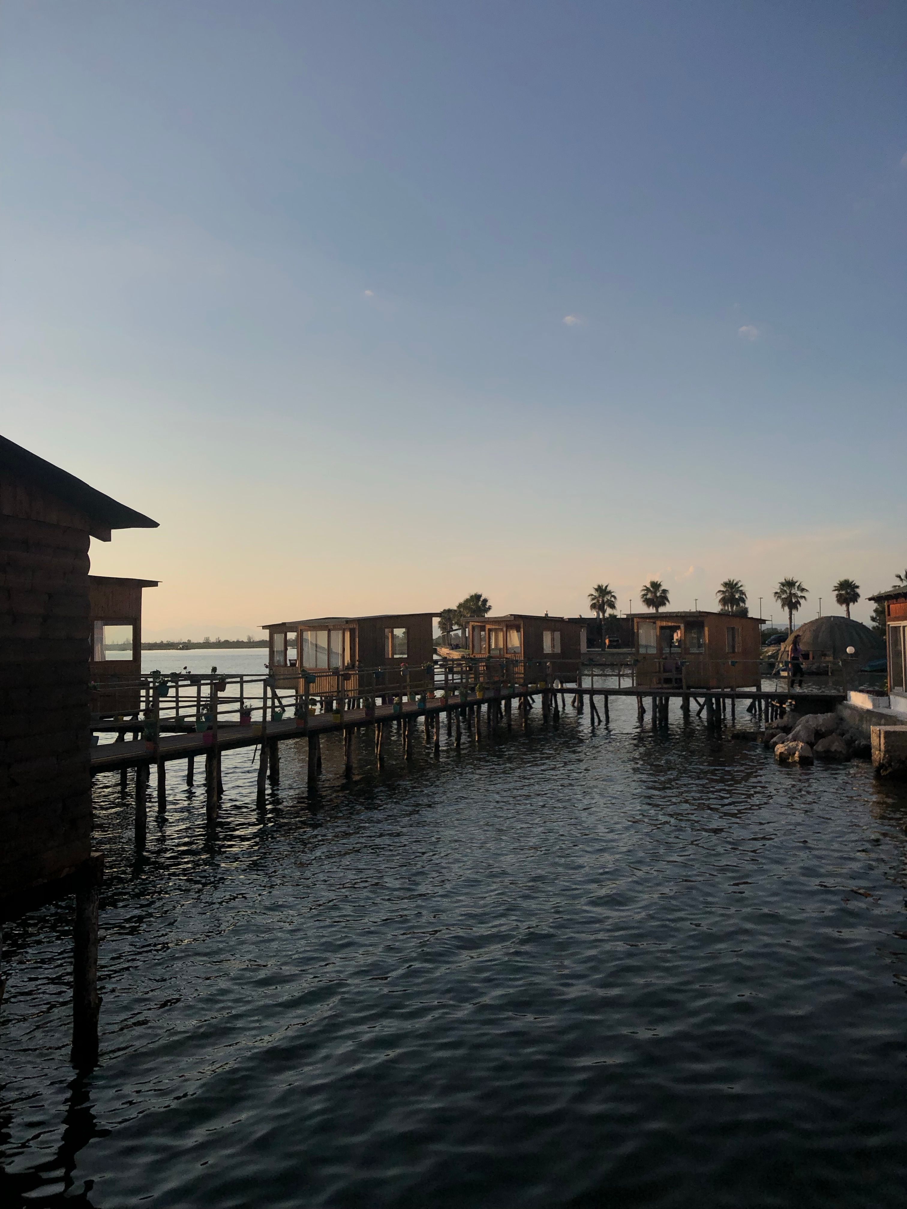 Wooden Sheds on Pier at Sunset · Free Stock Photo