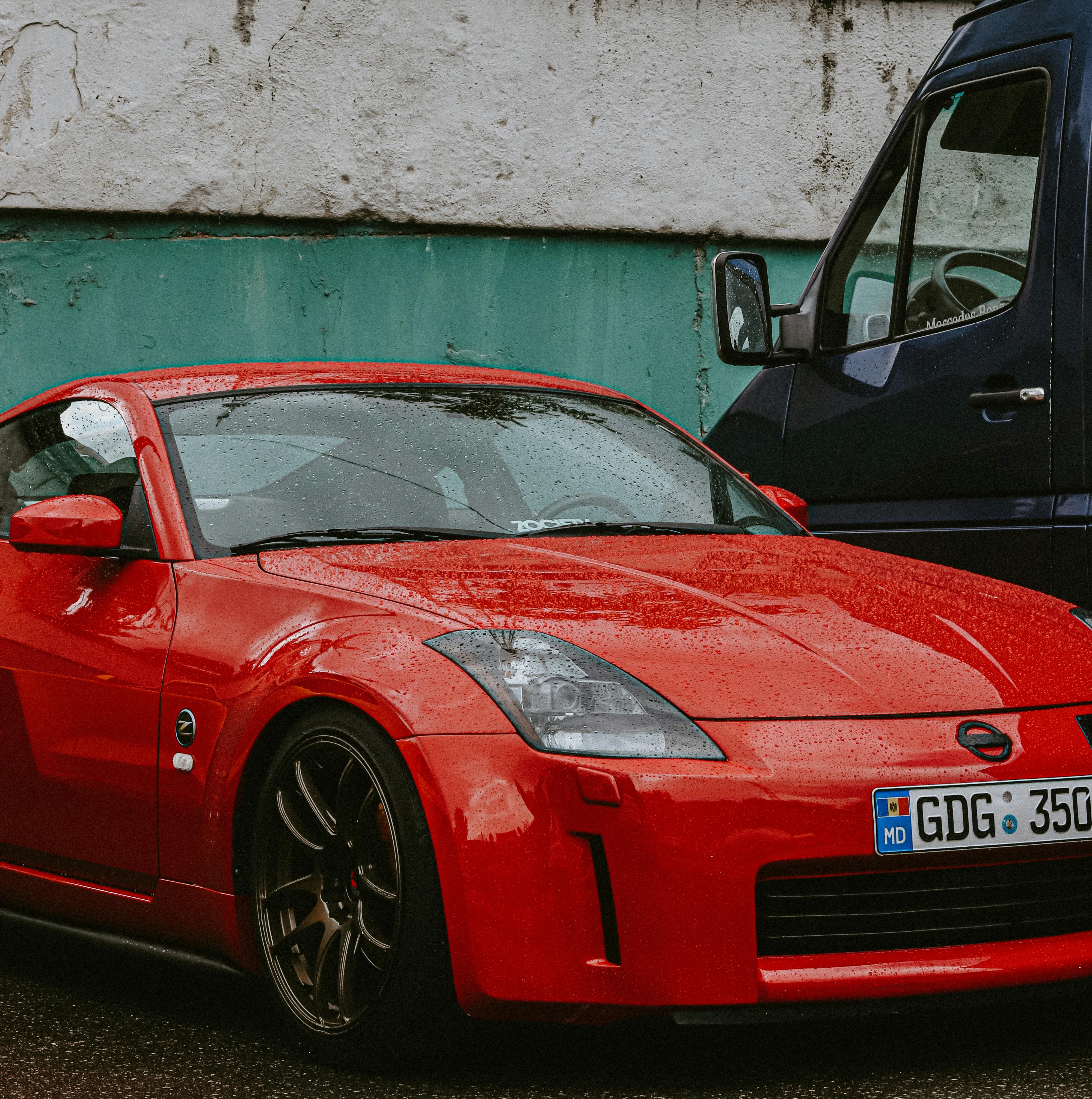 Red Sports Car Parked in Moldova · Free Stock Photo