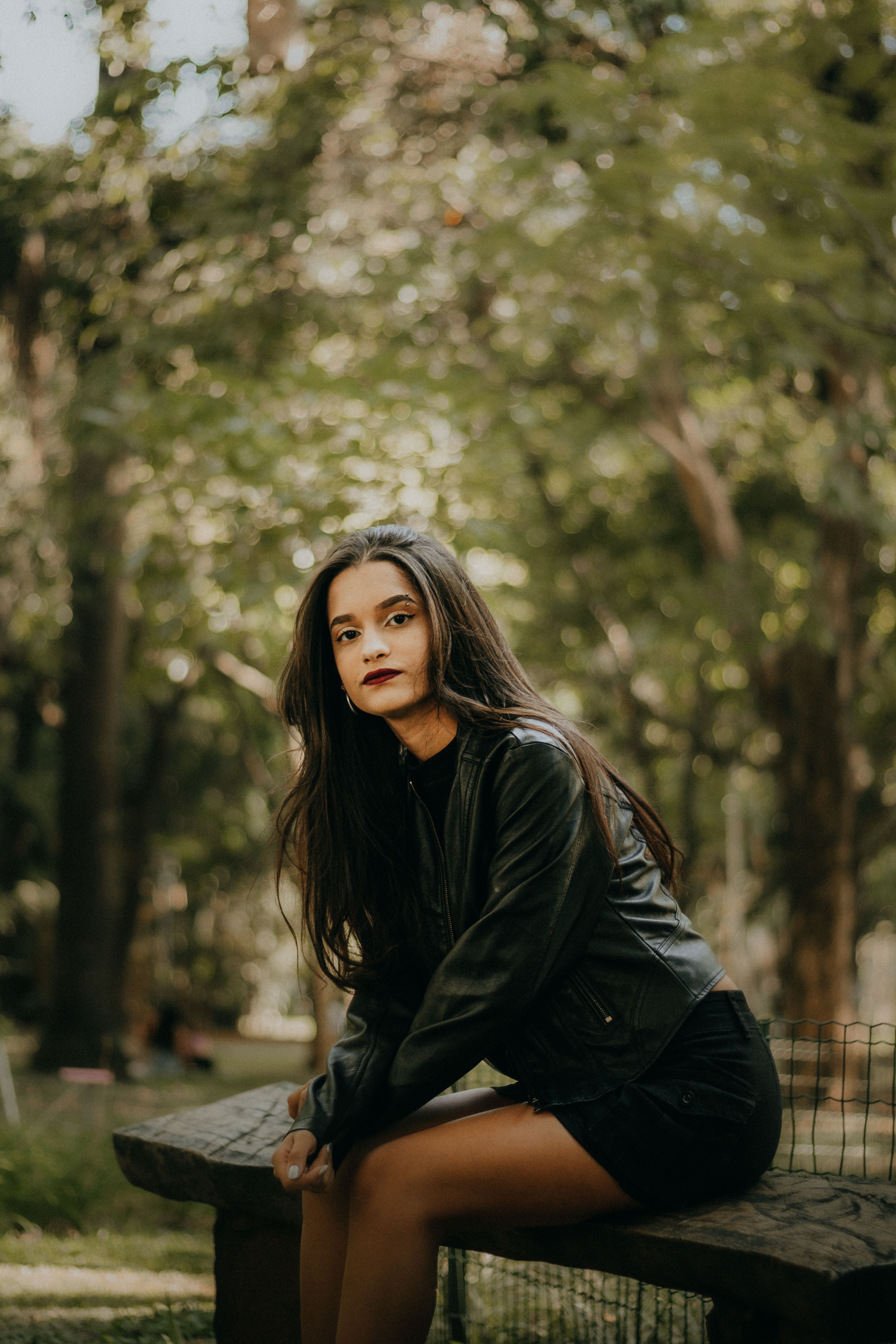 Woman Posing on Bench · Free Stock Photo
