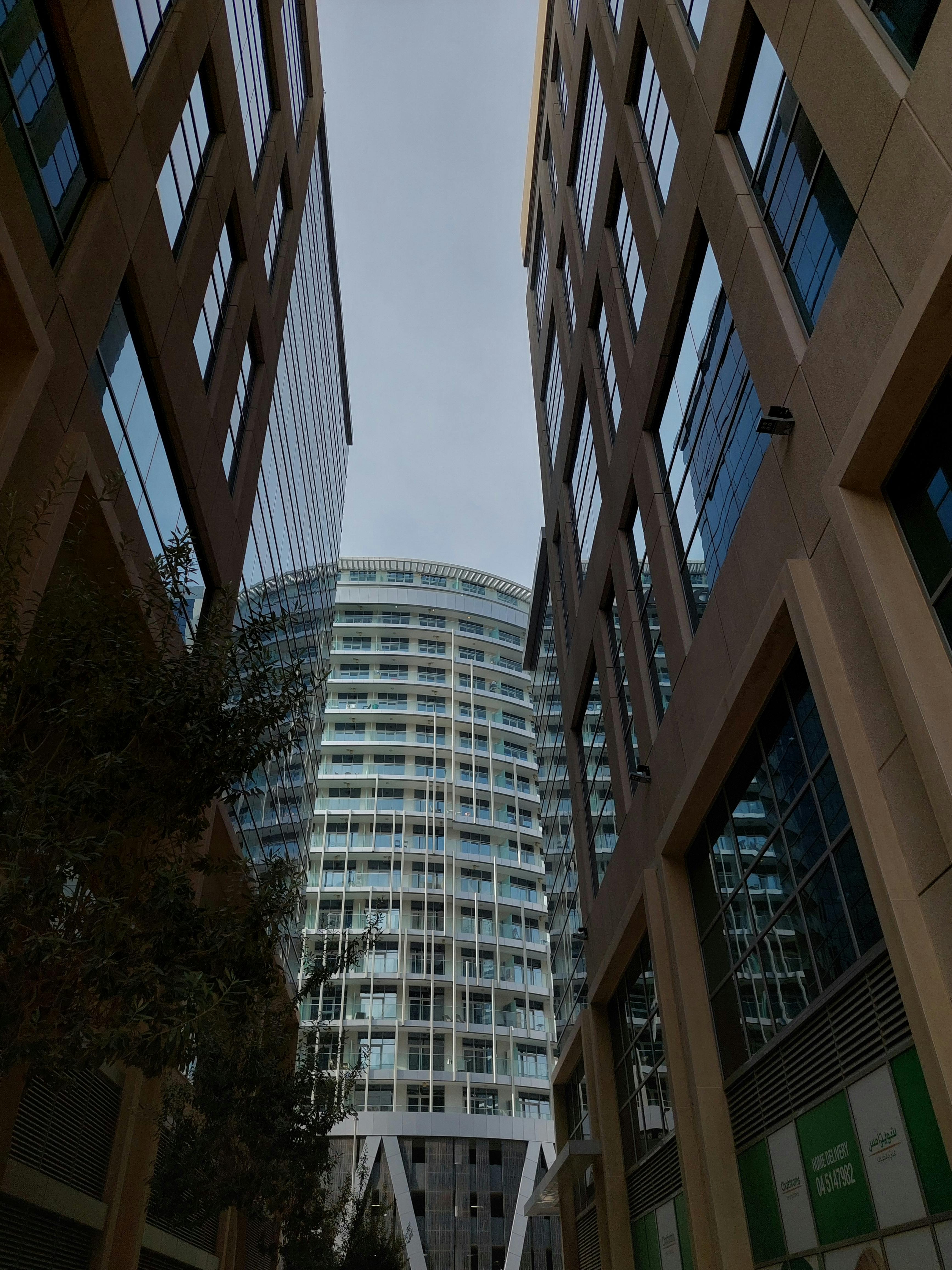 Grey Concrete Round High Rise Building · Free Stock Photo