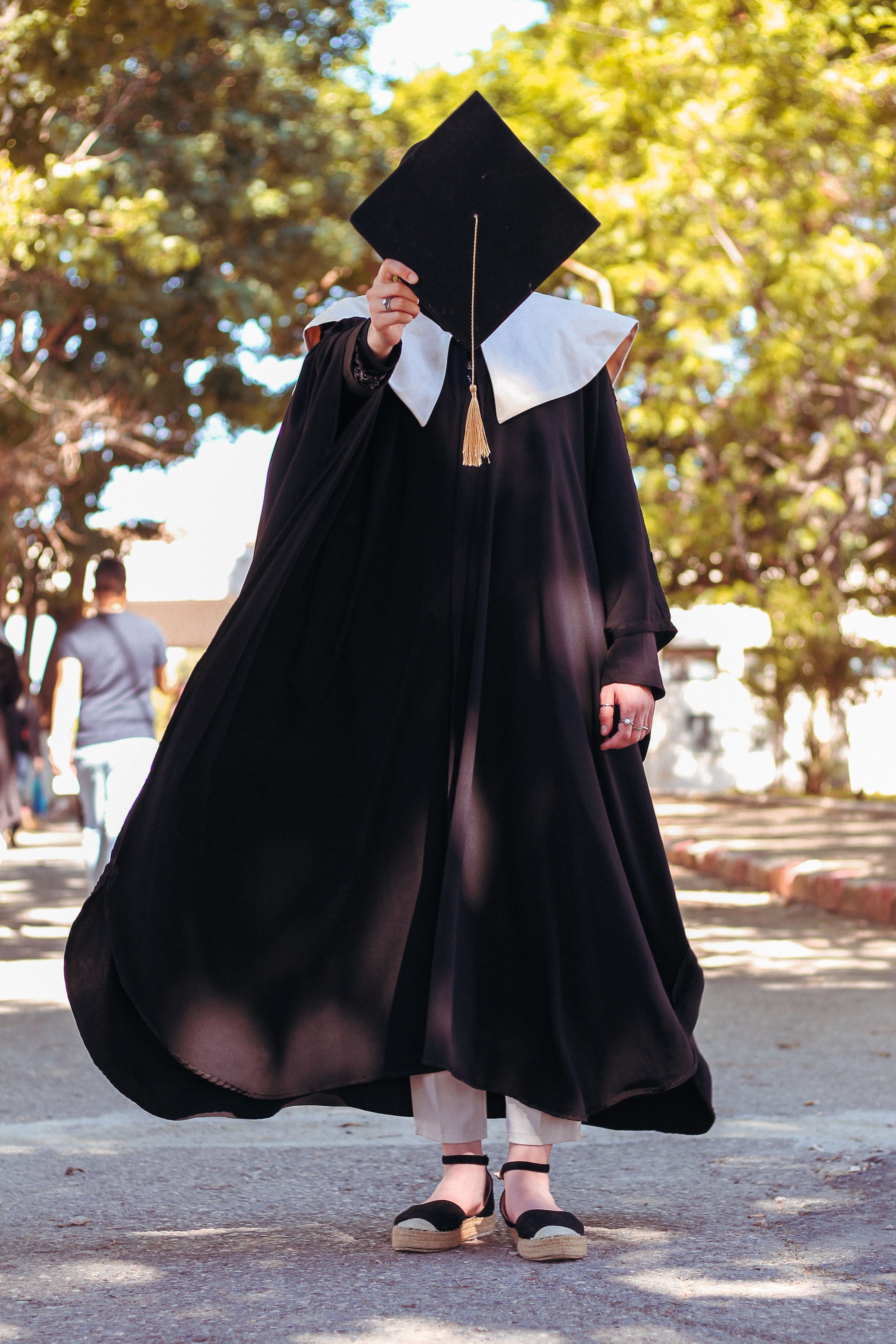 WOMAN IN BLACK ACADEMIC GOWN · Free Stock Photo