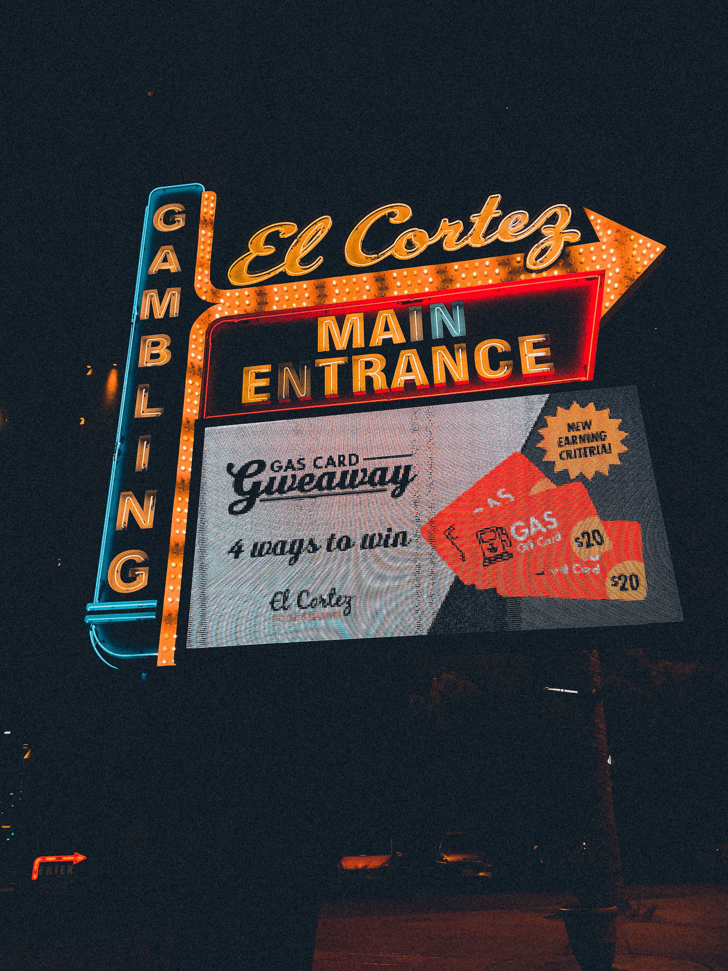 Illuminated Retro Sign on Night Street · Free Stock Photo