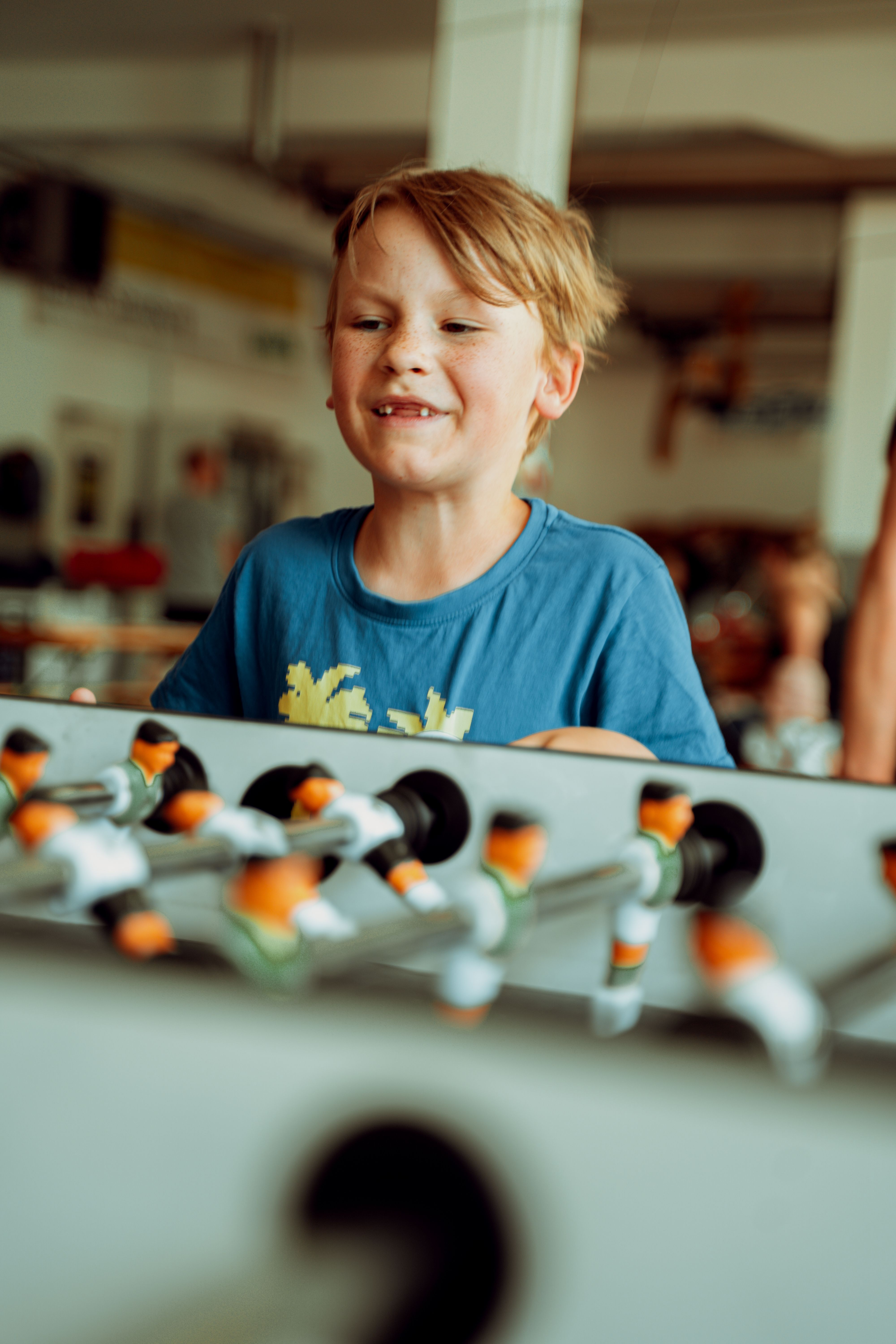 Boy Standing over Table Football · Free Stock Photo