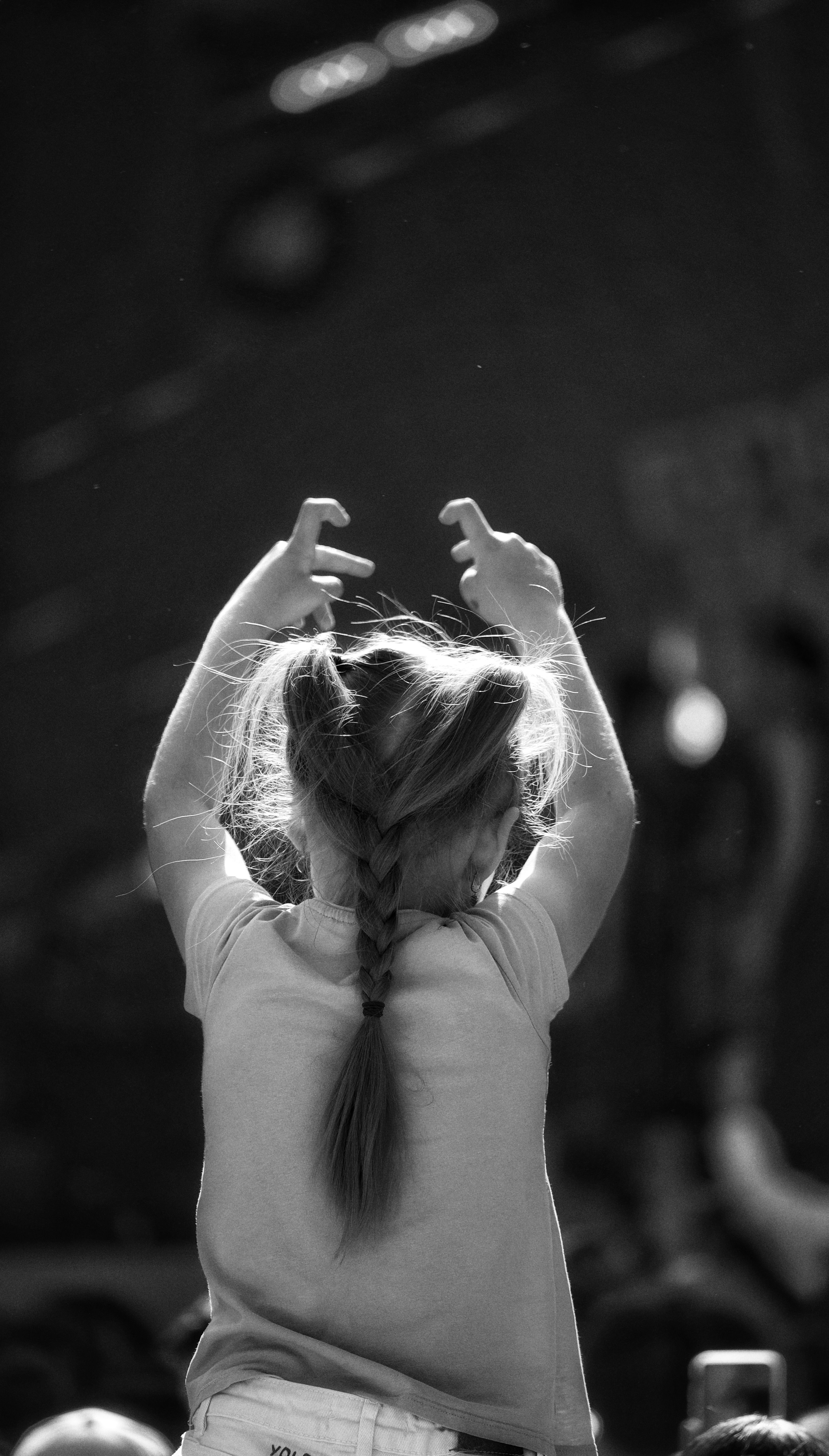 Back View of a Girl Sitting on a Persons Shoulders at a Concert · Free ...