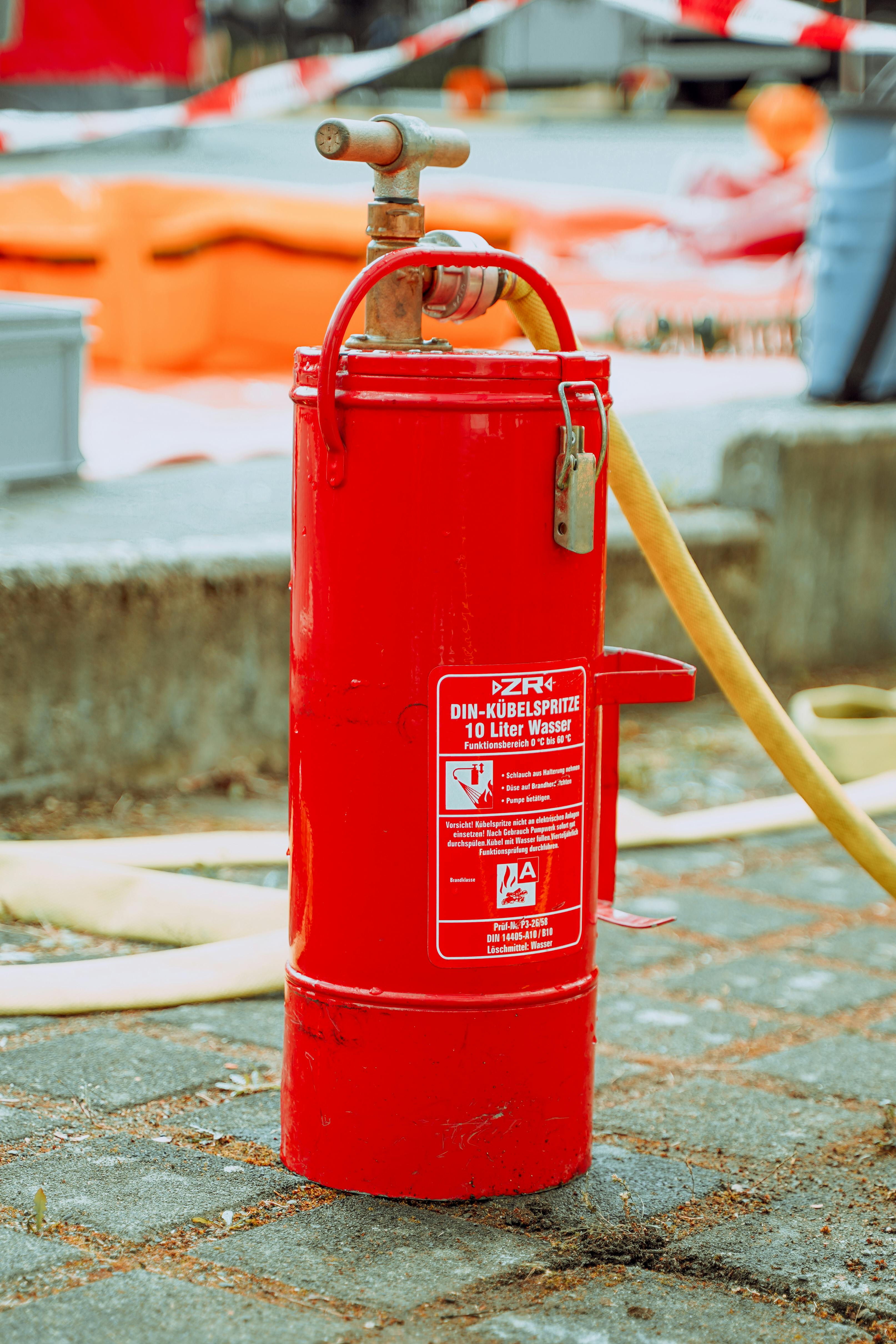 Mounted Fire Extinguisher on a Post · Free Stock Photo