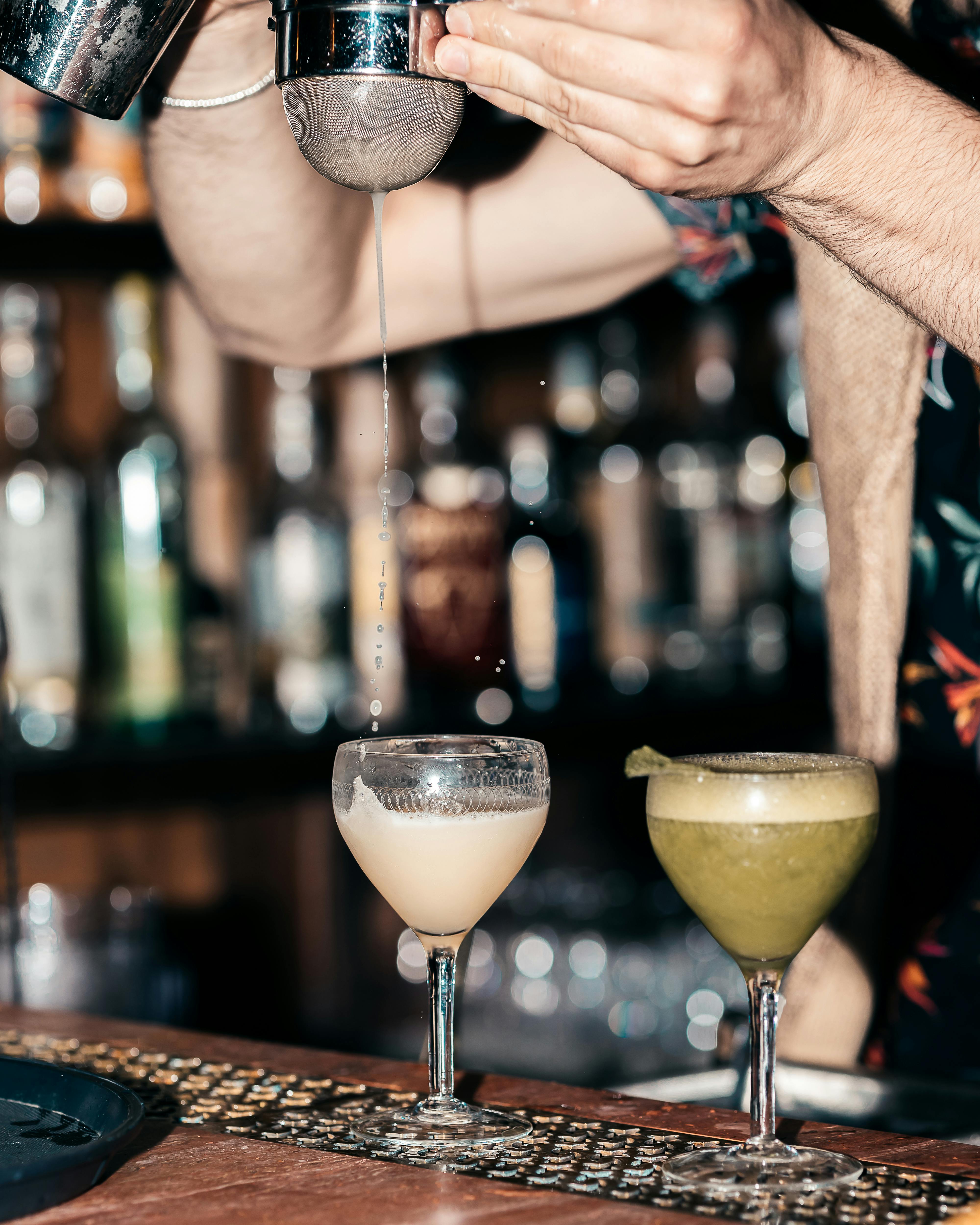 Bartender Preparing Drinks in a Bar · Free Stock Photo