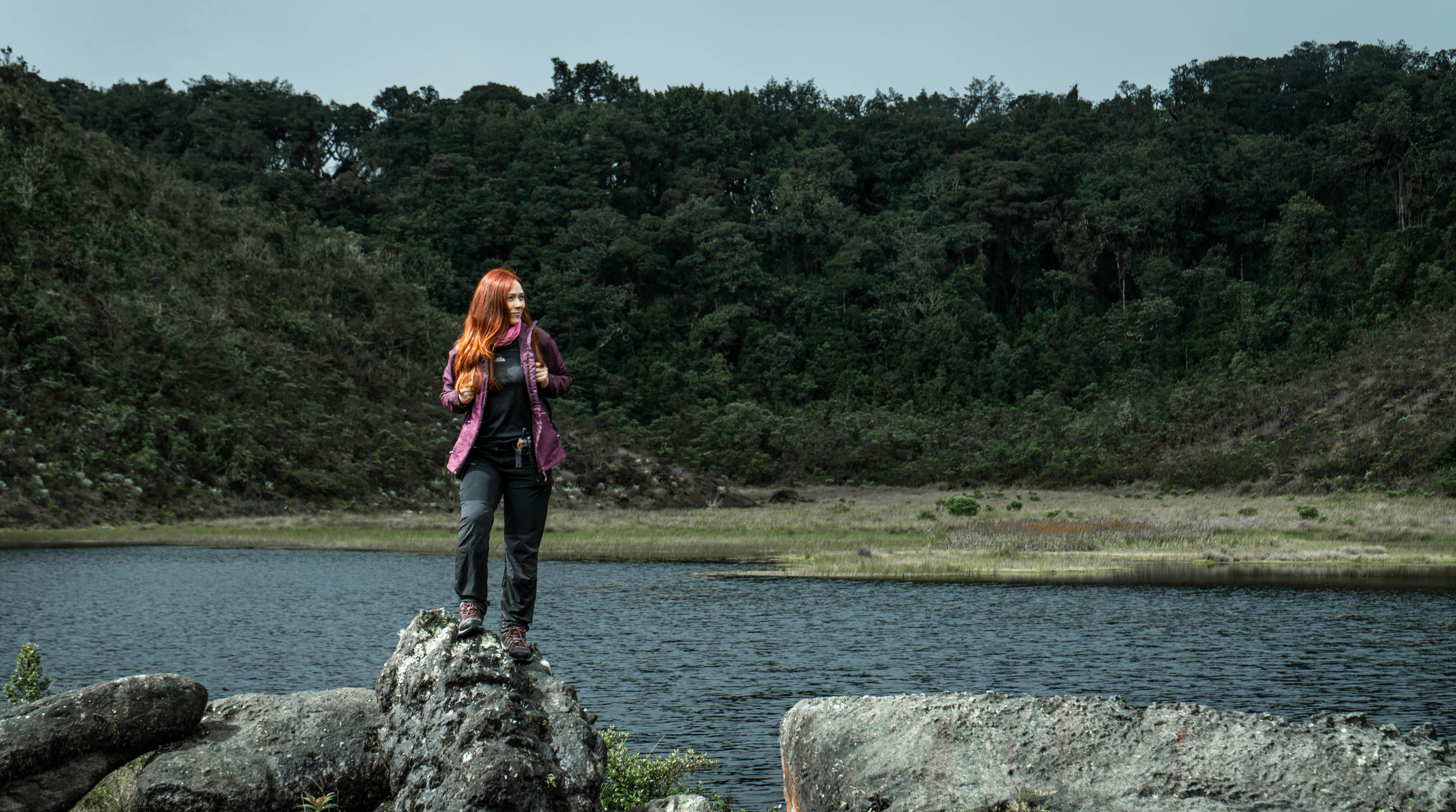 Woman Posing on Rocks over River · Free Stock Photo