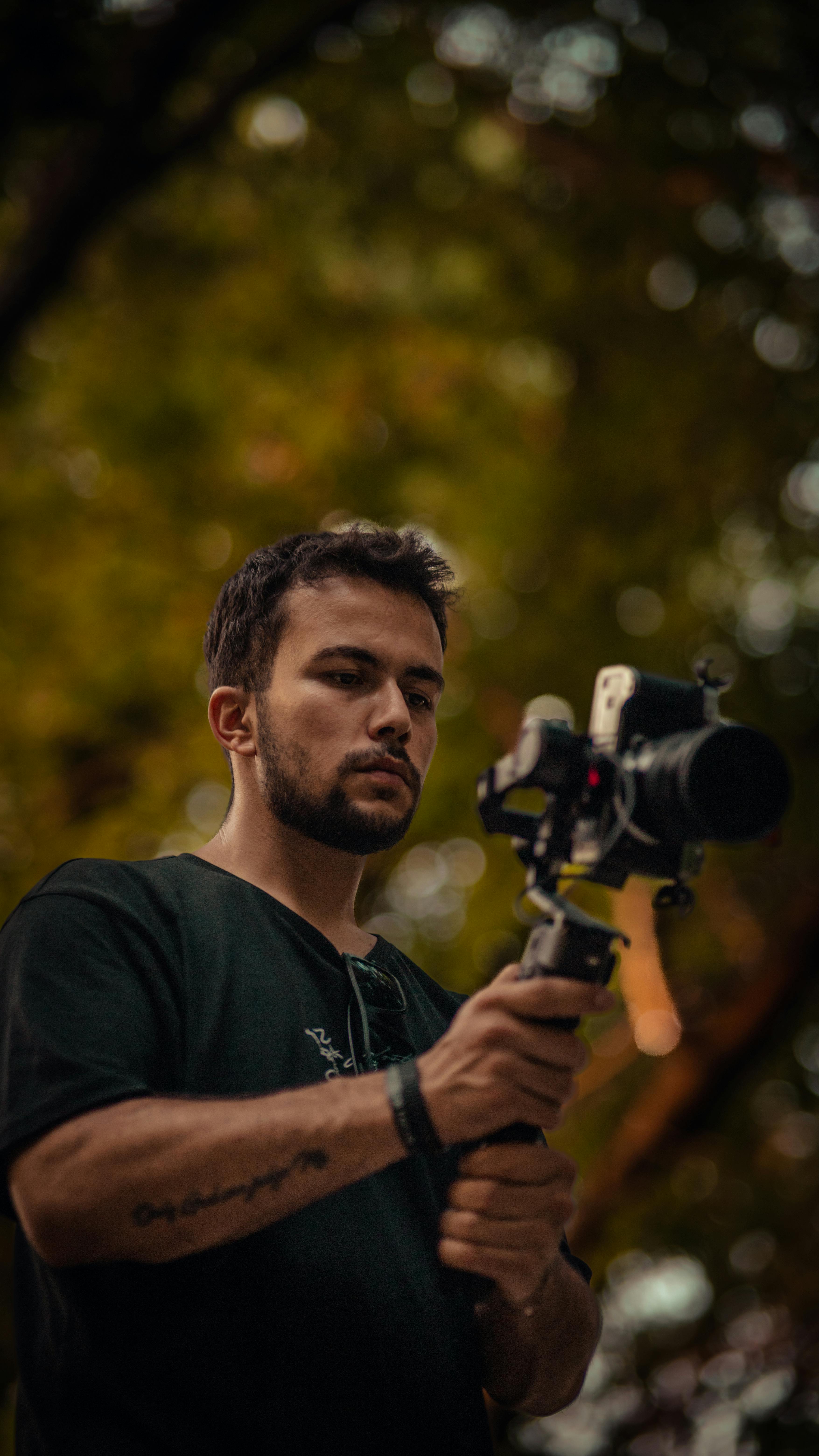 Man Standing with Camera · Free Stock Photo