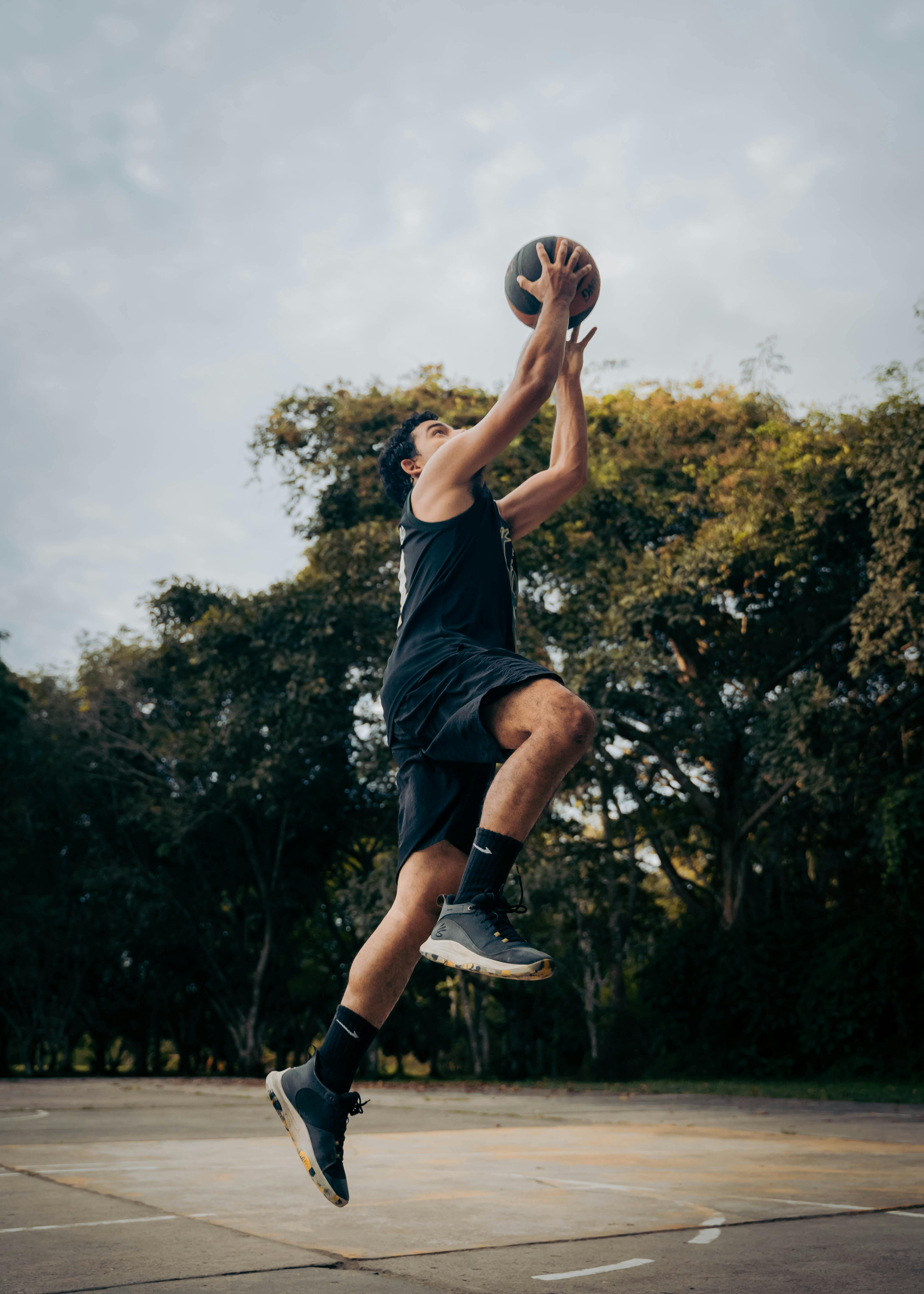 Man Throwing Basketball Ball · Free Stock Photo