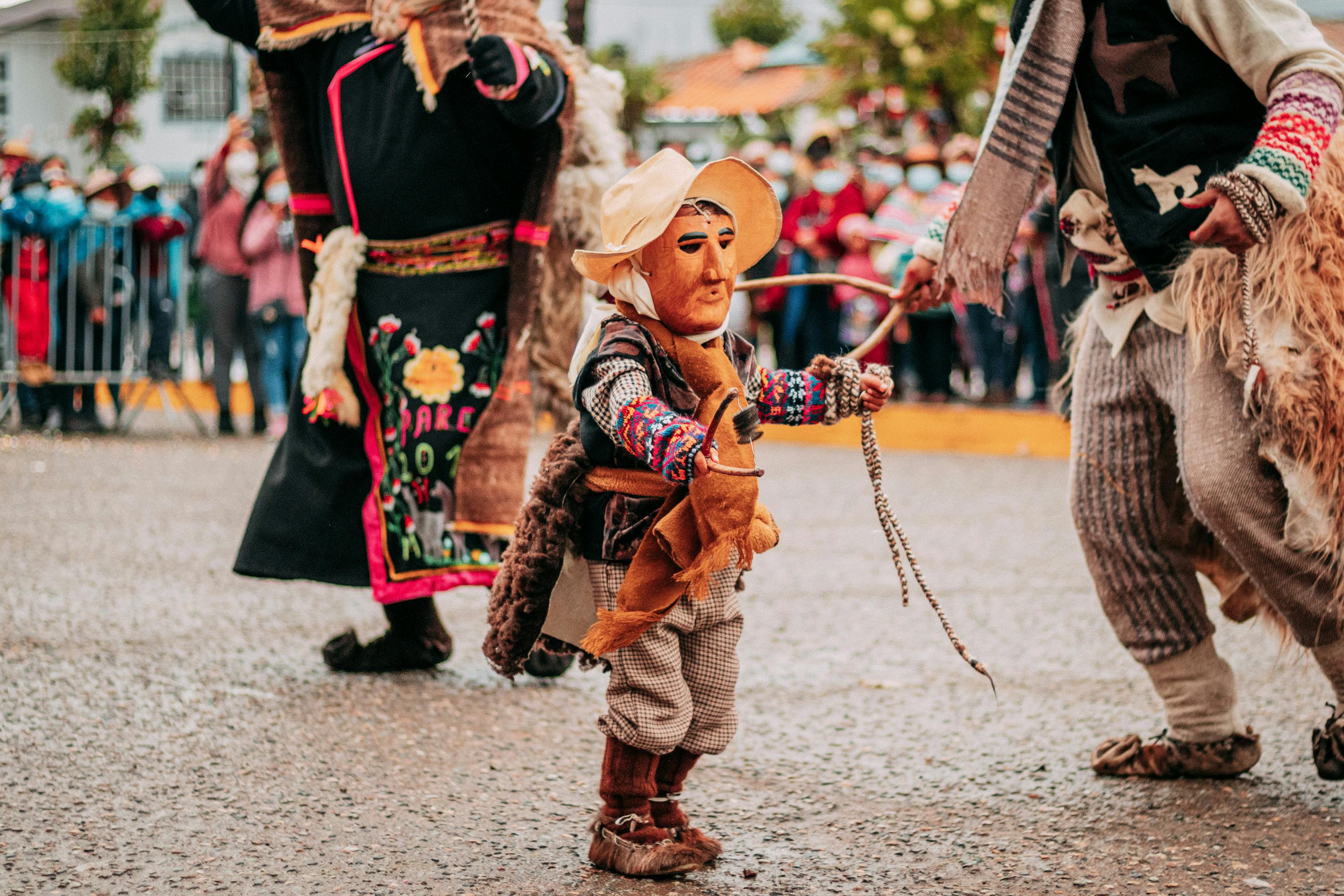 People Dancing in Folklore Clothing, and Child with a Mask · Free Stock ...