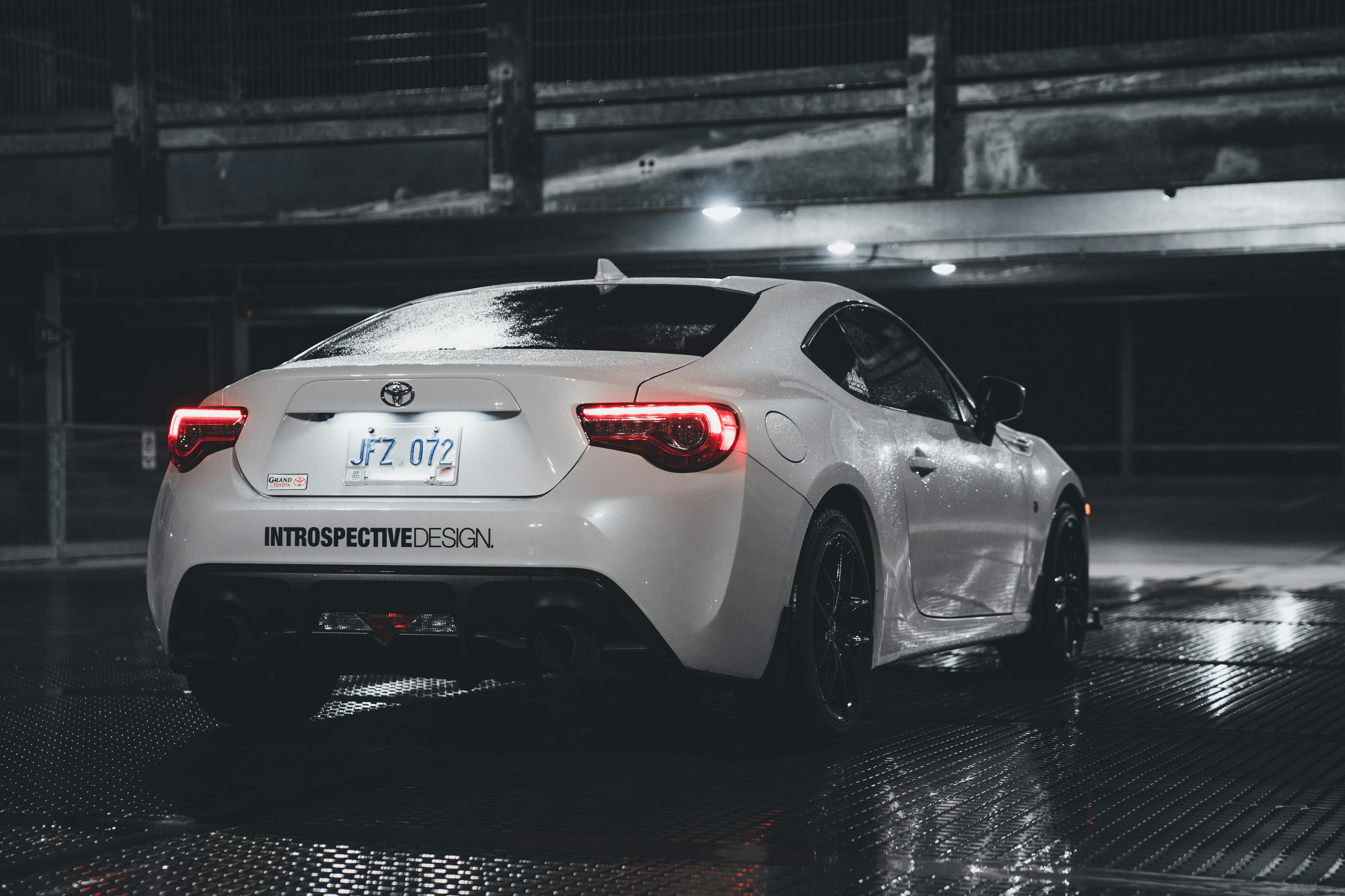 Rear View on White Toyota in Autumn · Free Stock Photo