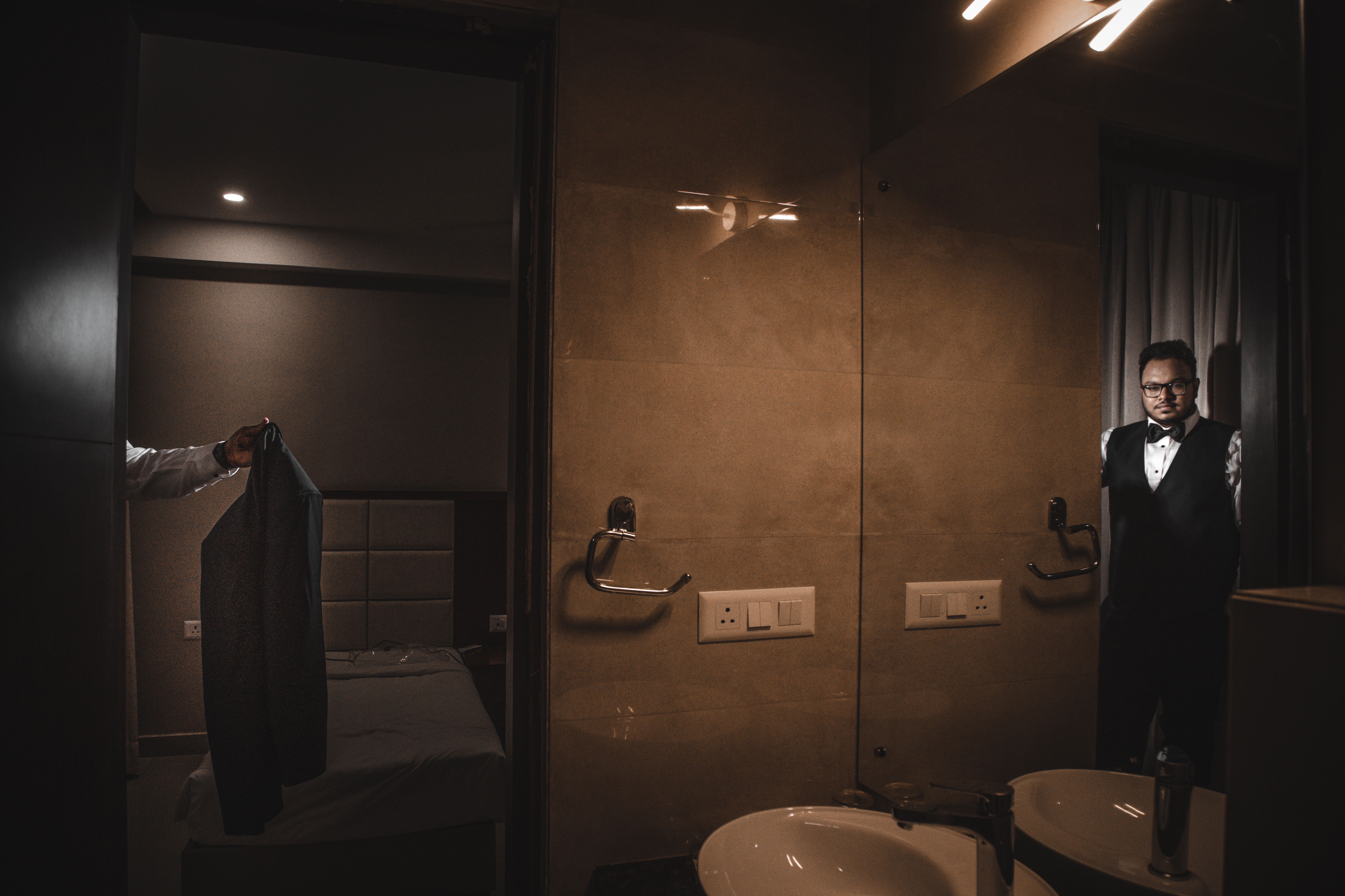 Man in a Suit in a Hotel Room · Free Stock Photo