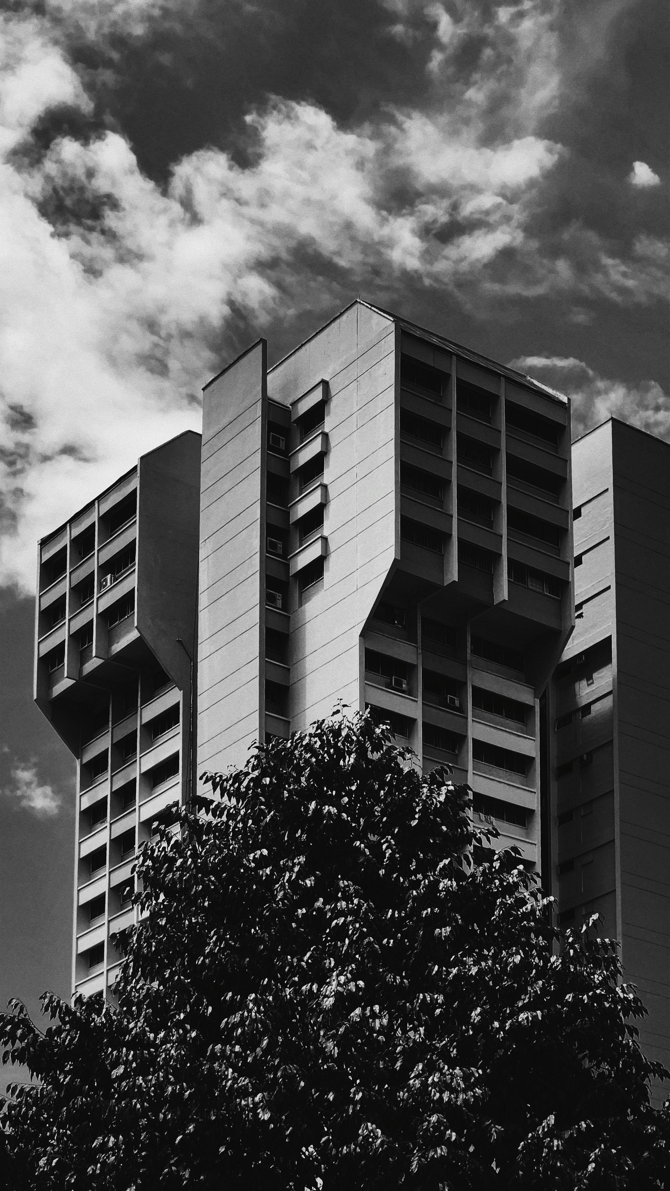 Black and White Photo of a Brutalist High-Rise Building · Free Stock Photo