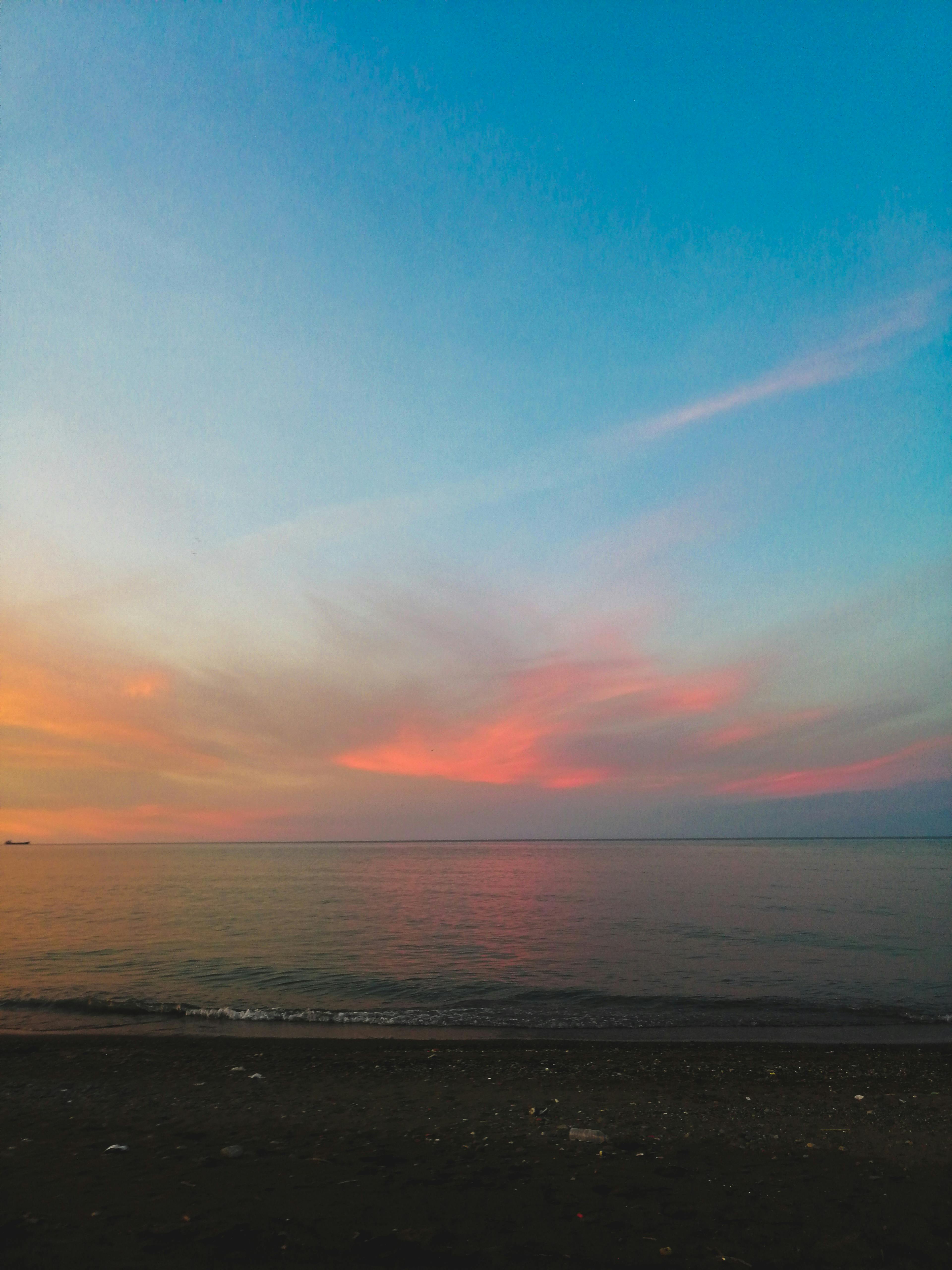 Seashore With Sea Waves during Daytime · Free Stock Photo