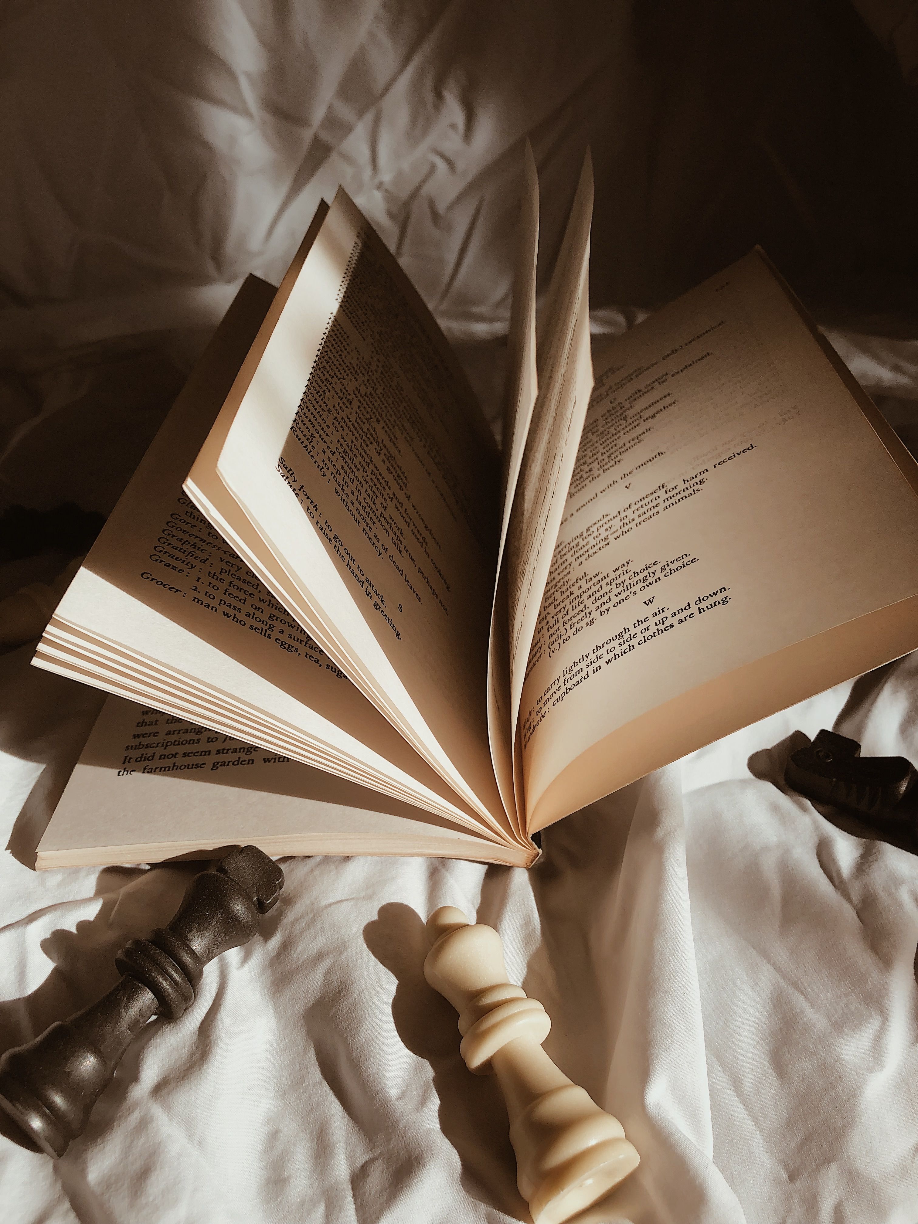 Open Book on Bedclothes · Free Stock Photo