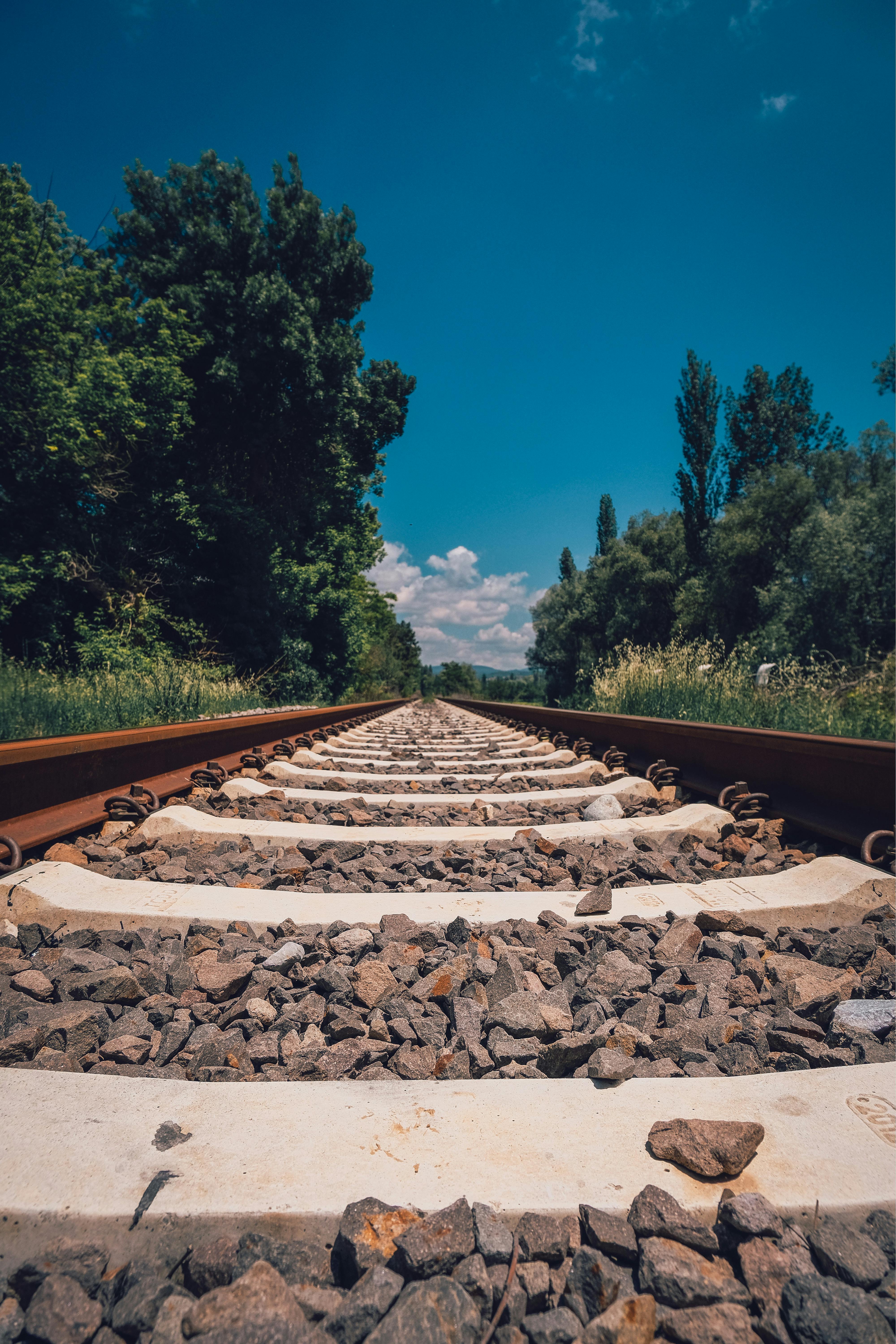 A Train on the Railroad Tracks · Free Stock Photo