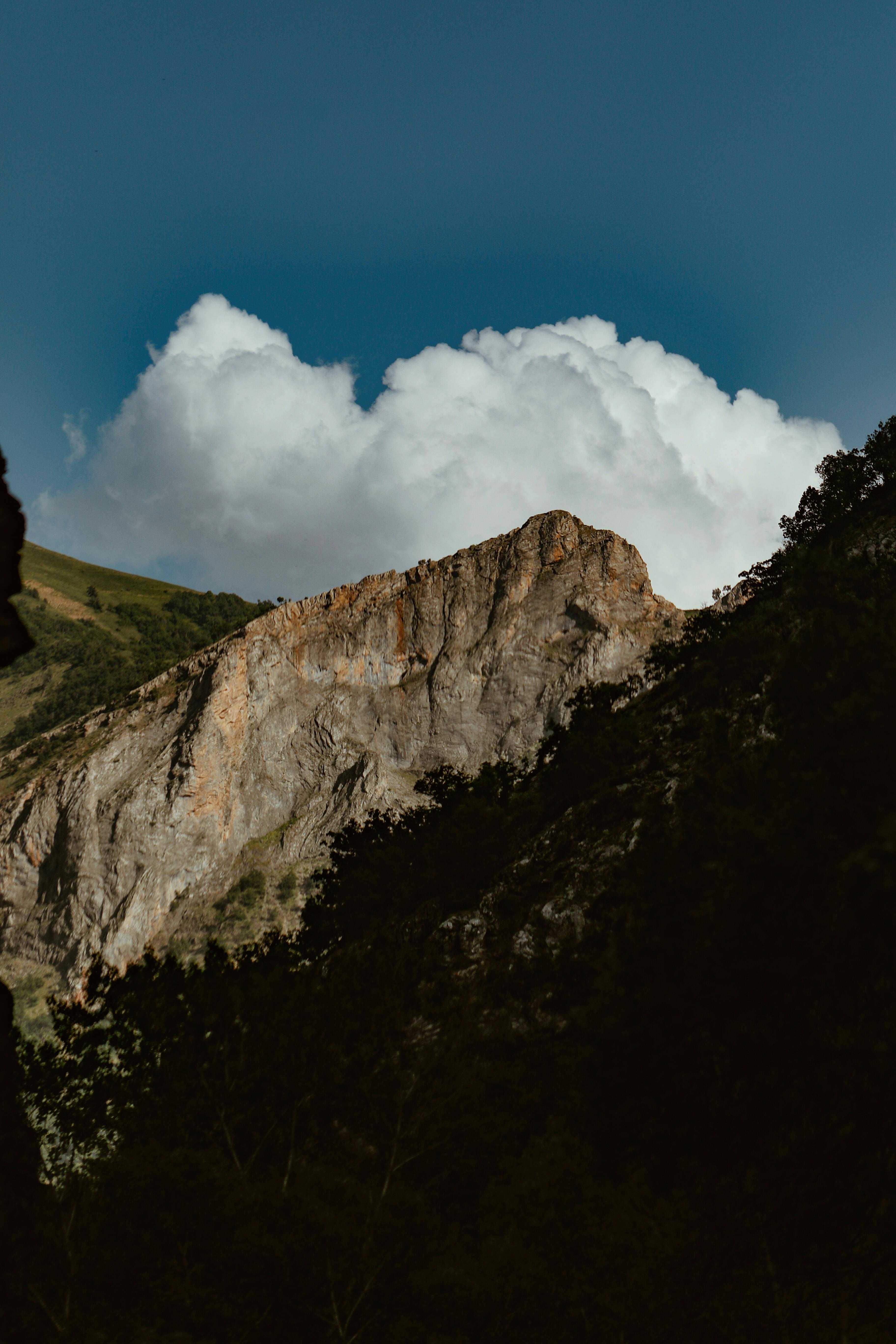 Woman on a Swing at the Top of a Mountain · Free Stock Photo