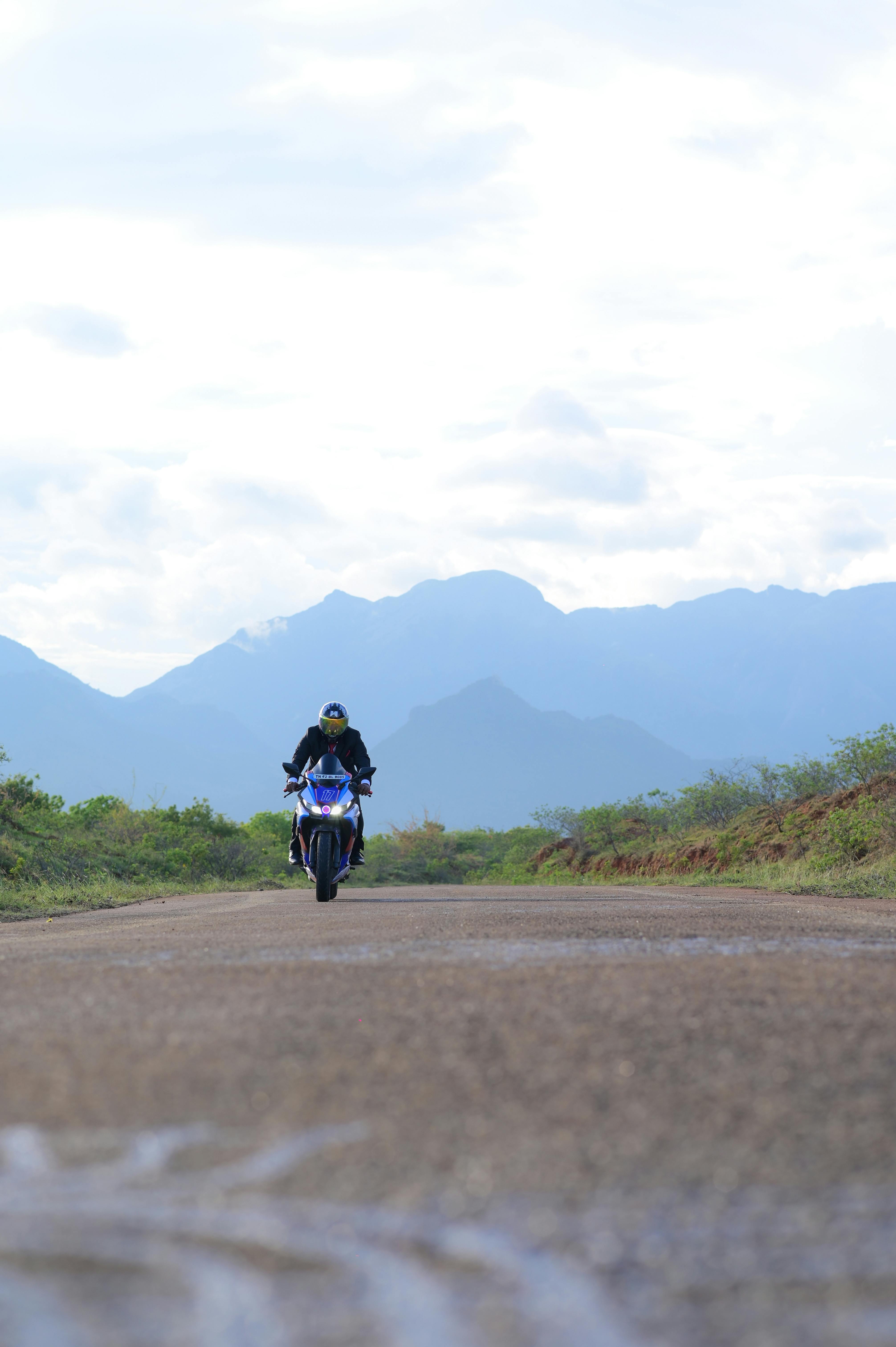 Person Riding Motorcycle during Golden Hour · Free Stock Photo