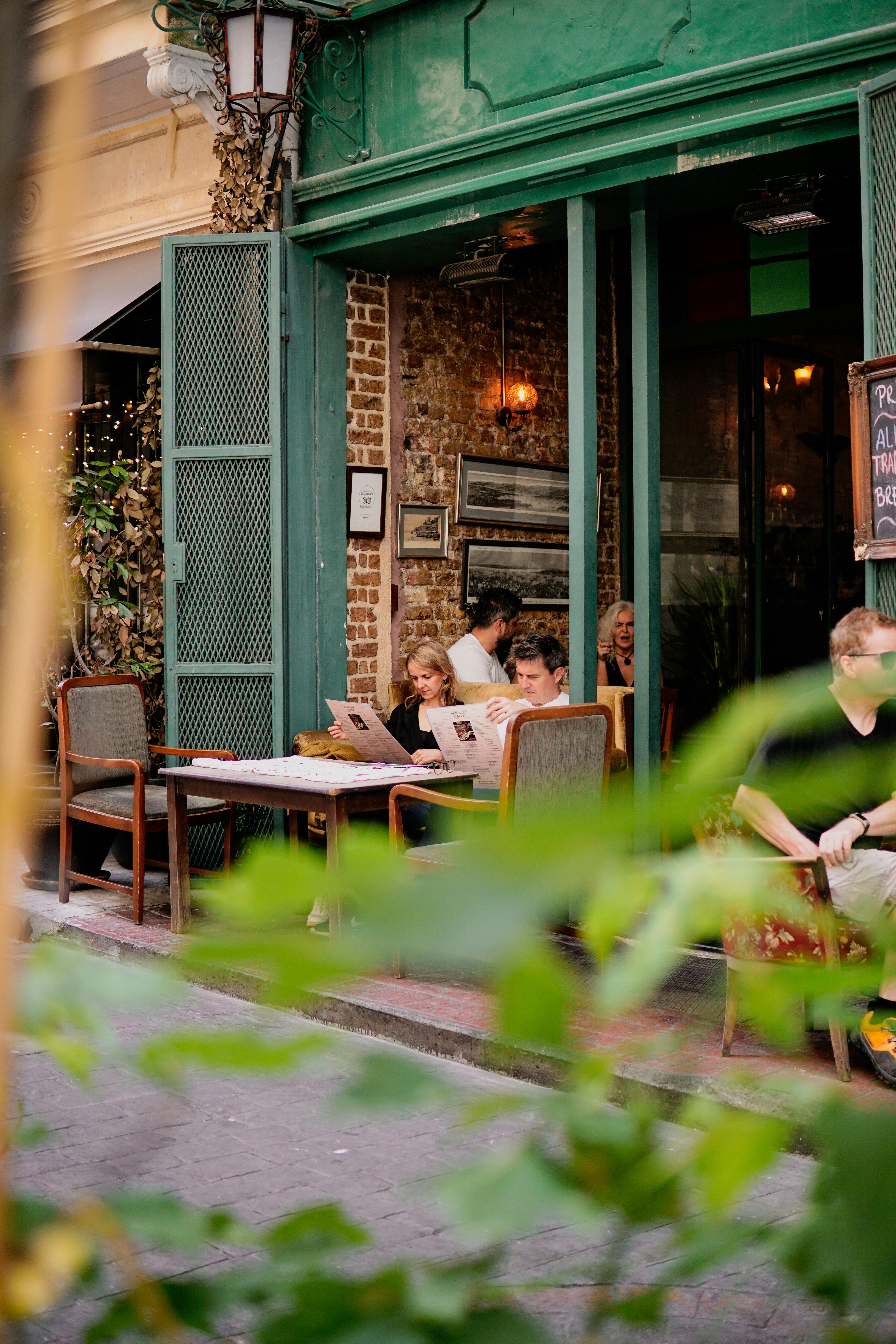 People Sitting in Cafe on Street · Free Stock Photo