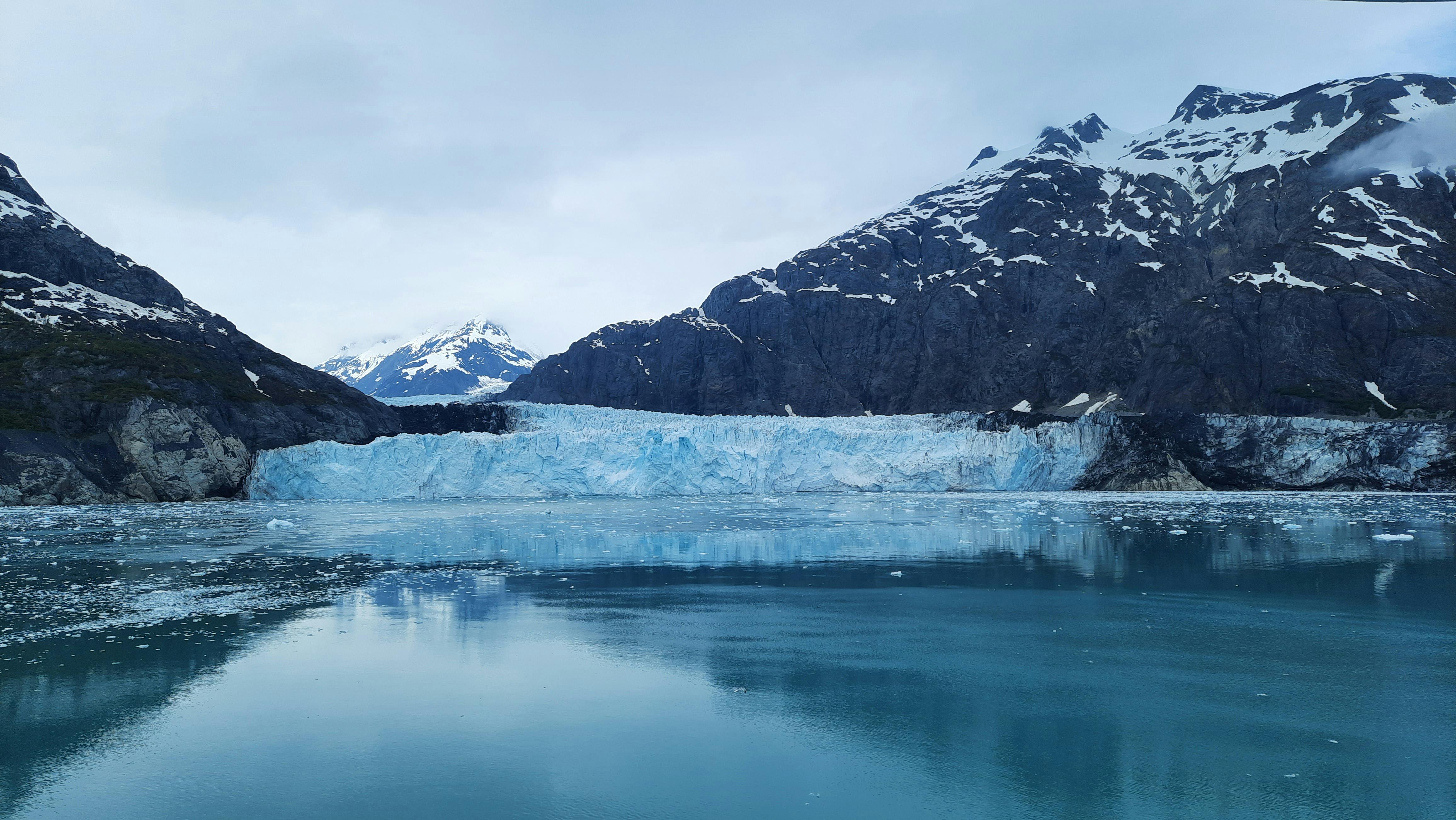 A Lake Between Brown Cliffs · Free Stock Photo