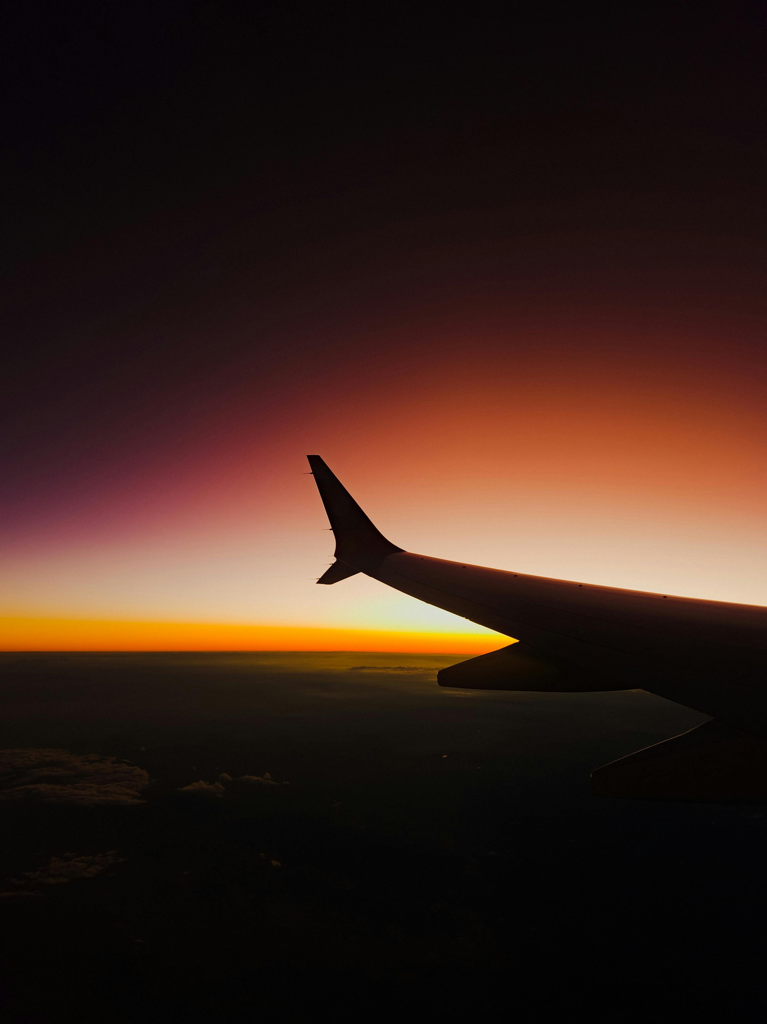 Airplane during Sunset · Free Stock Photo