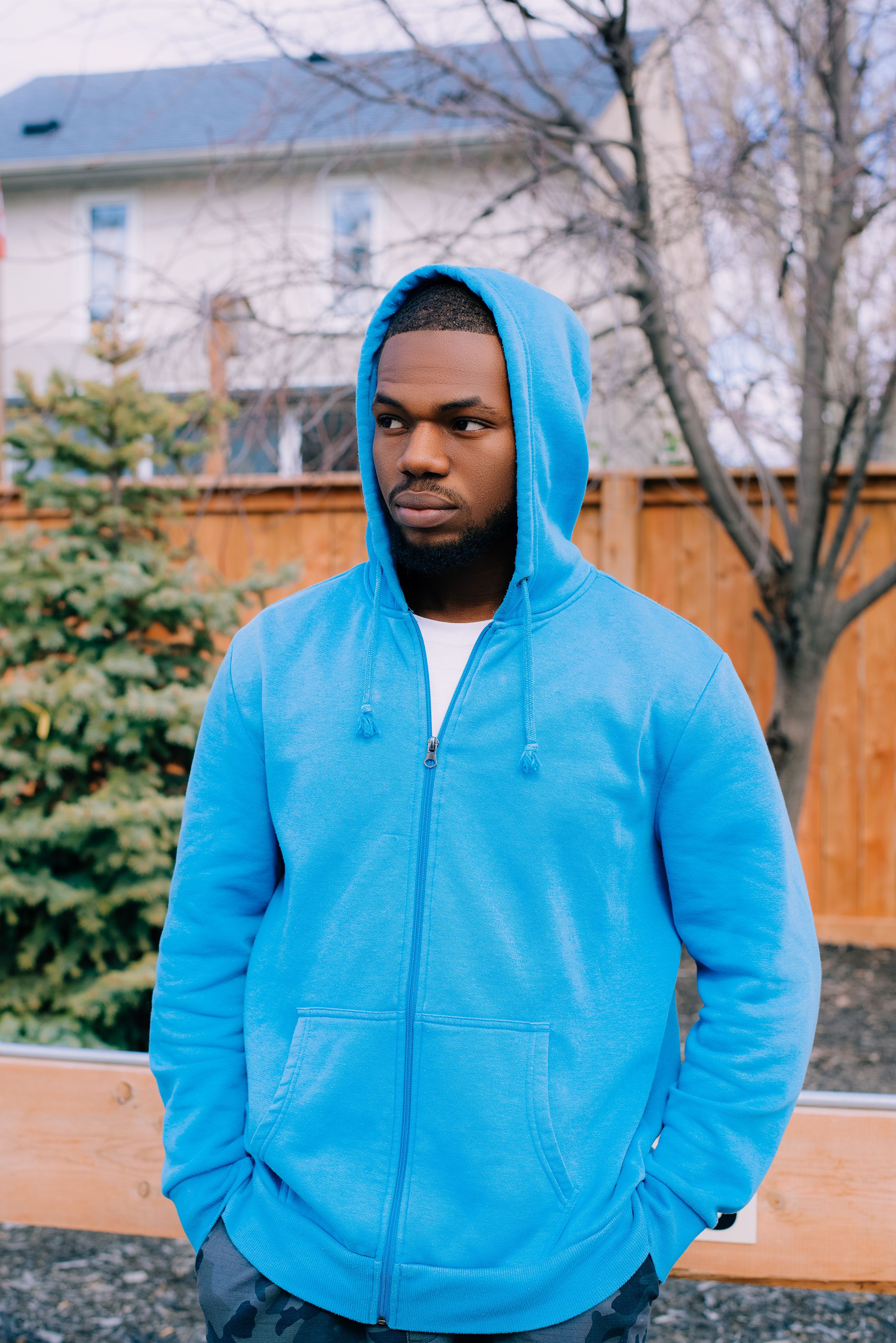 Man Posing in Blue Hoodie · Free Stock Photo