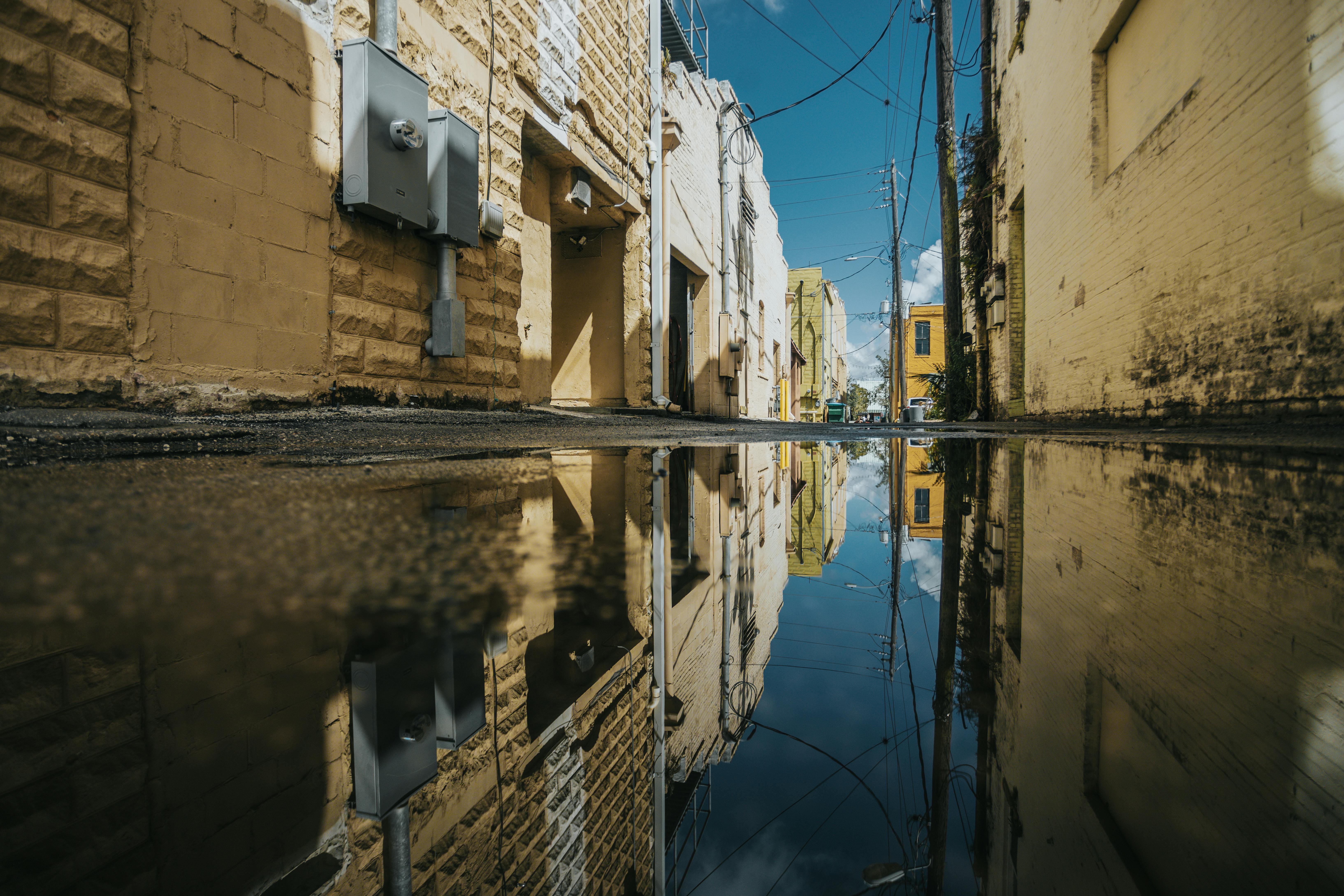 Puddle on Street in Town · Free Stock Photo