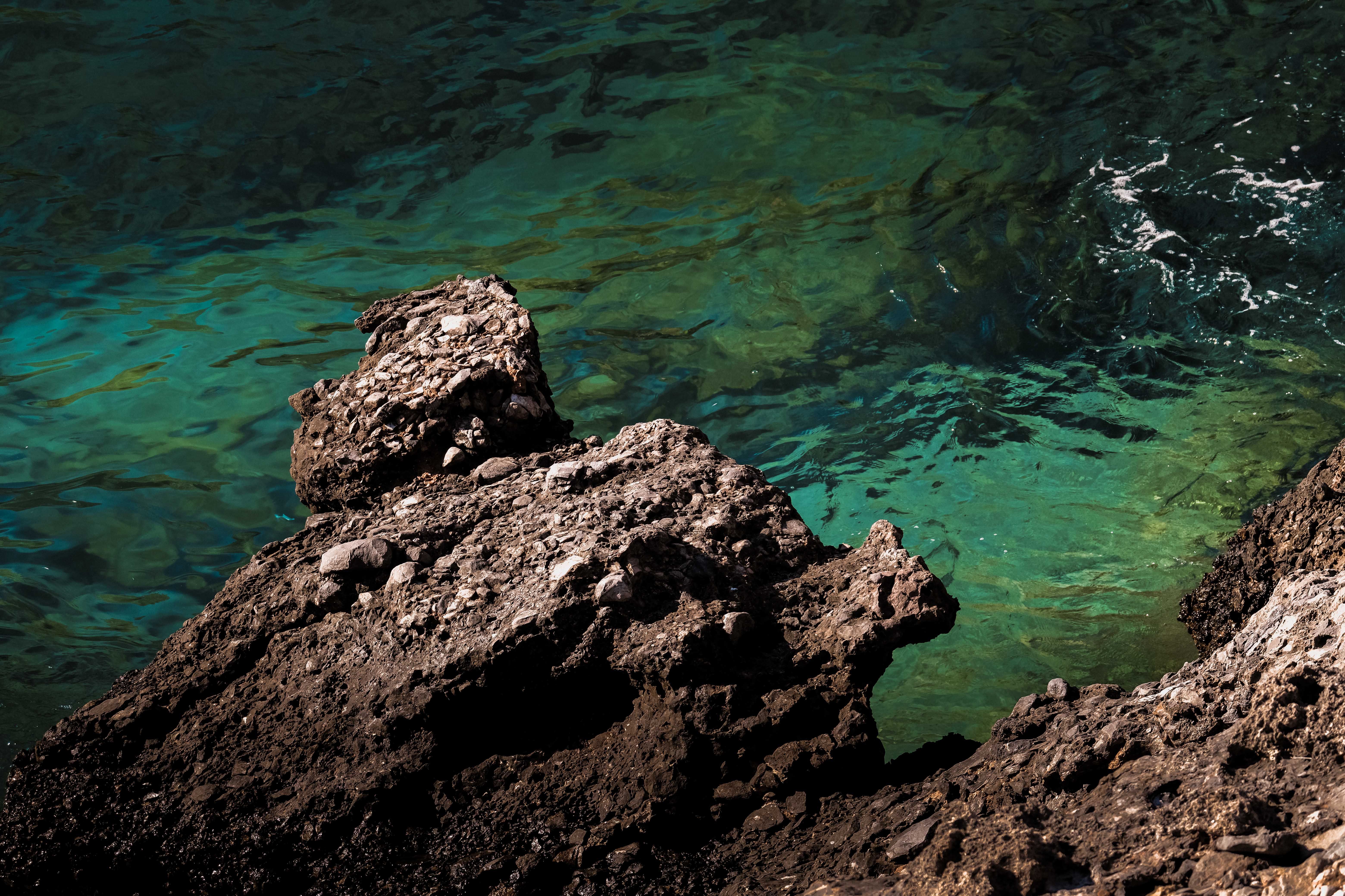 Close up of Sunlit Rock near Water · Free Stock Photo
