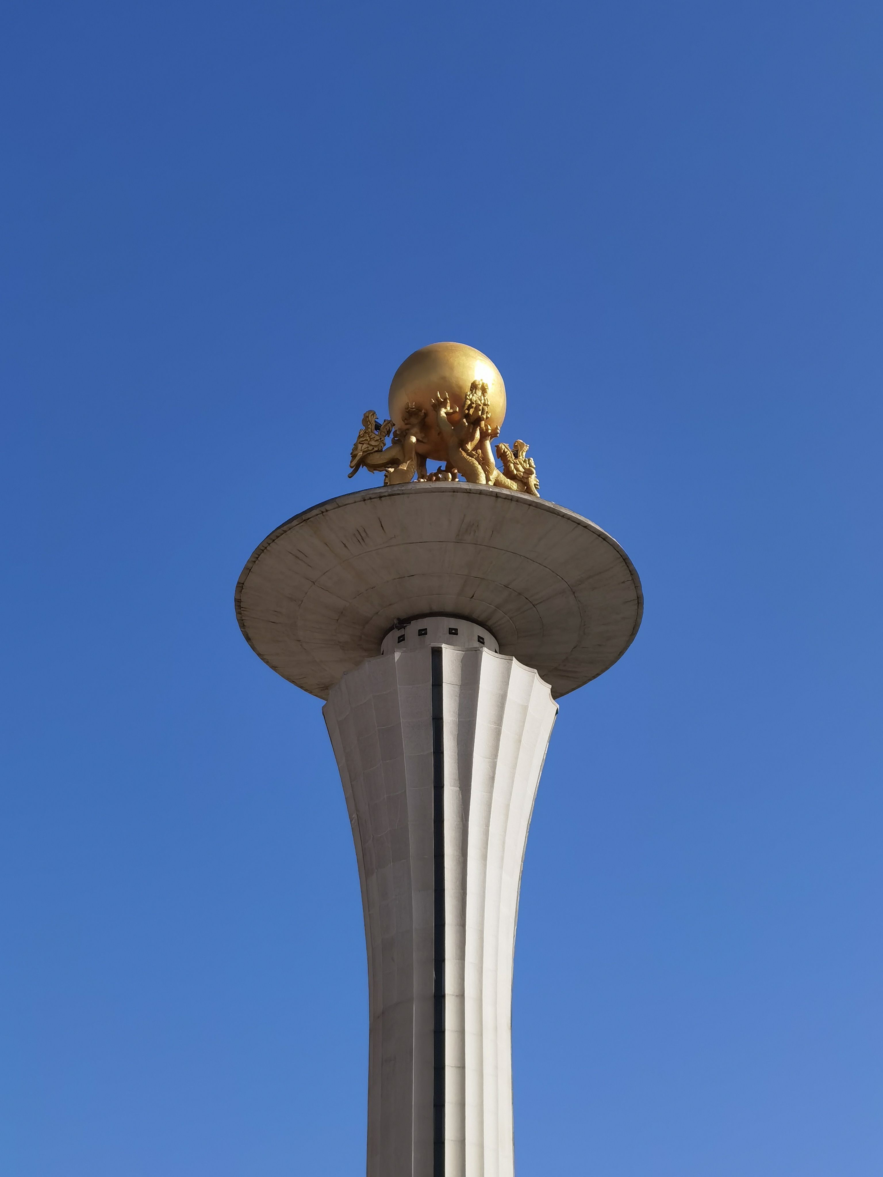 Clear Sky over Golden Top of Monument · Free Stock Photo