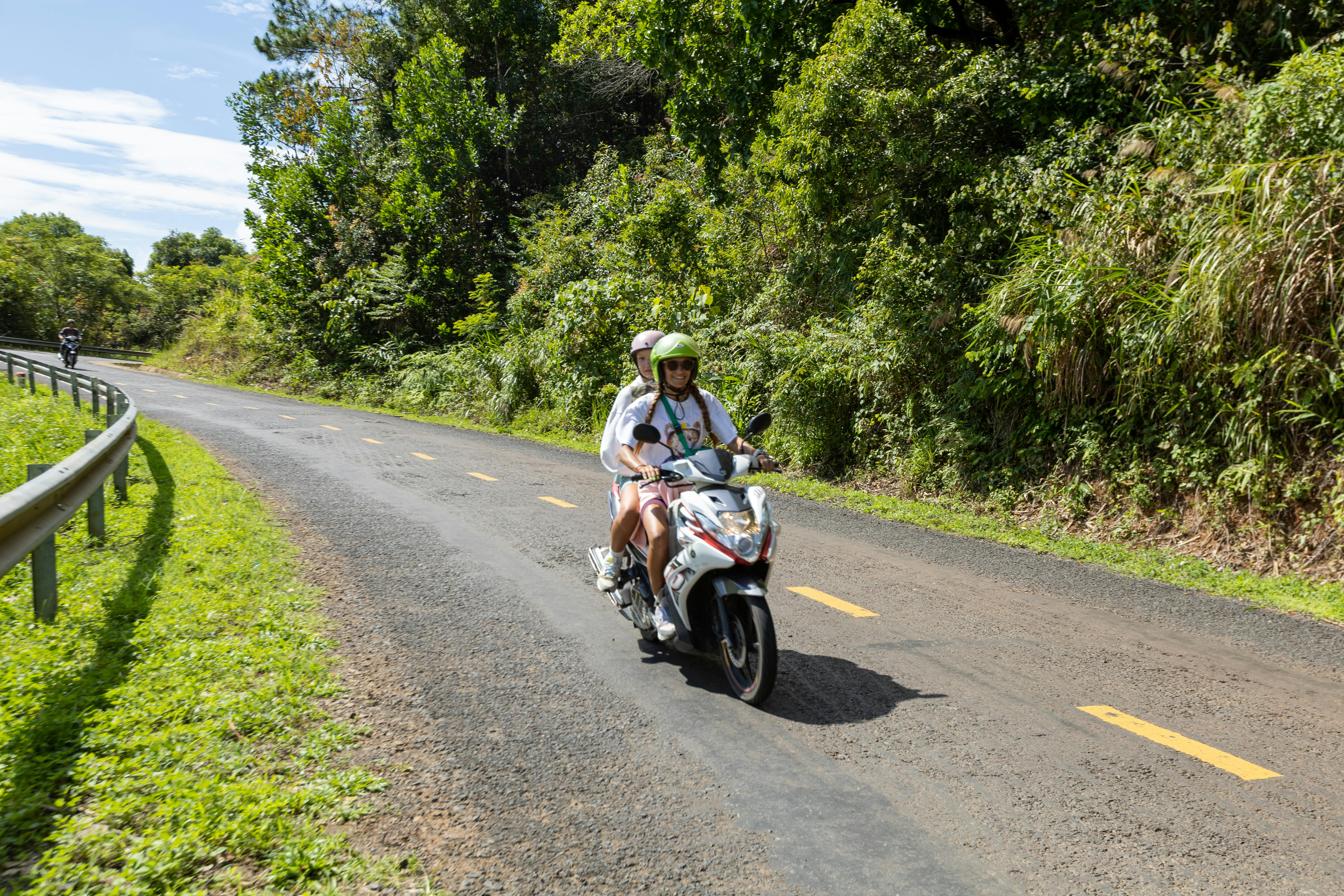 Woman and Man Riding Motor Scooter Together · Free Stock Photo