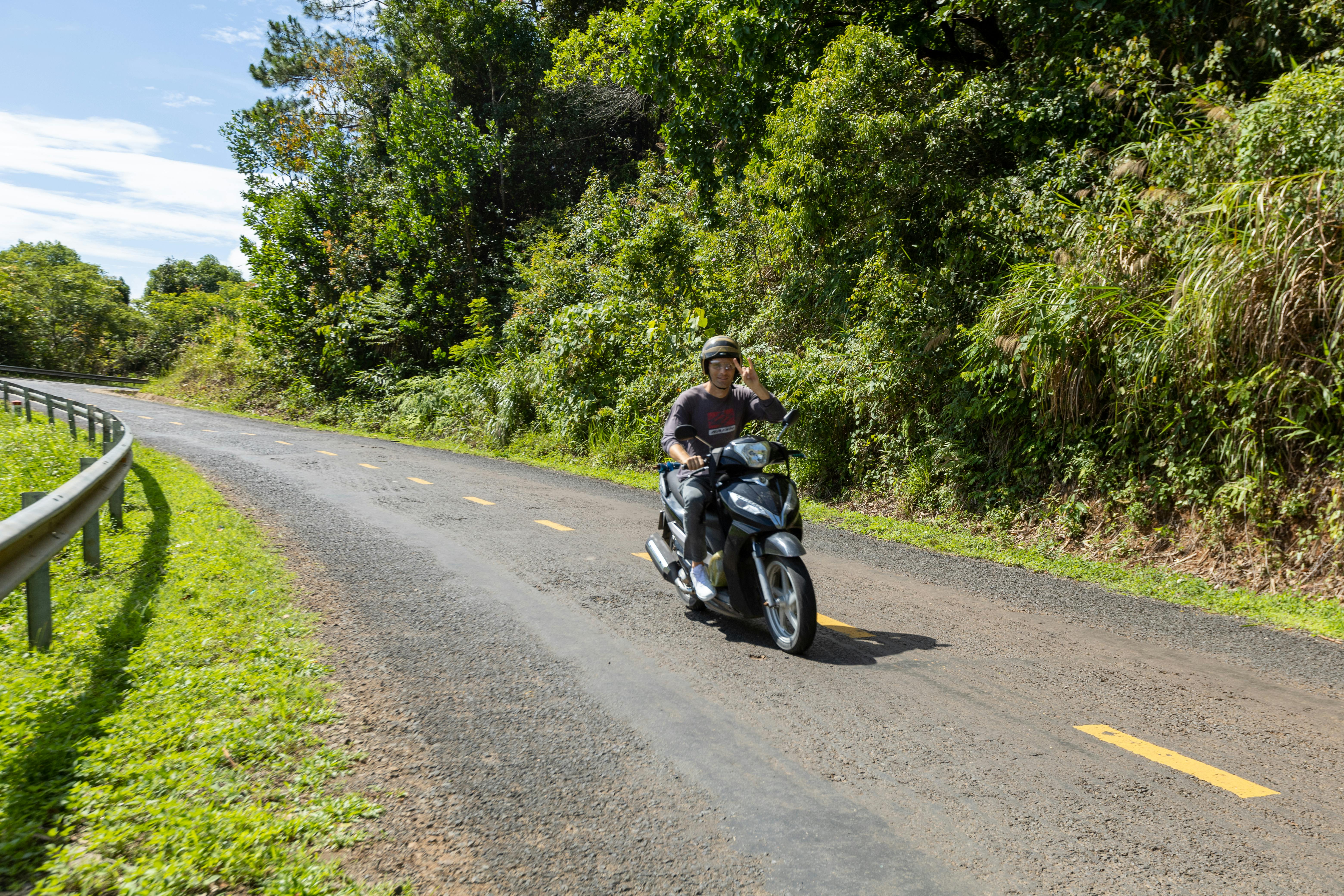 Man Riding on Motor Scooter · Free Stock Photo