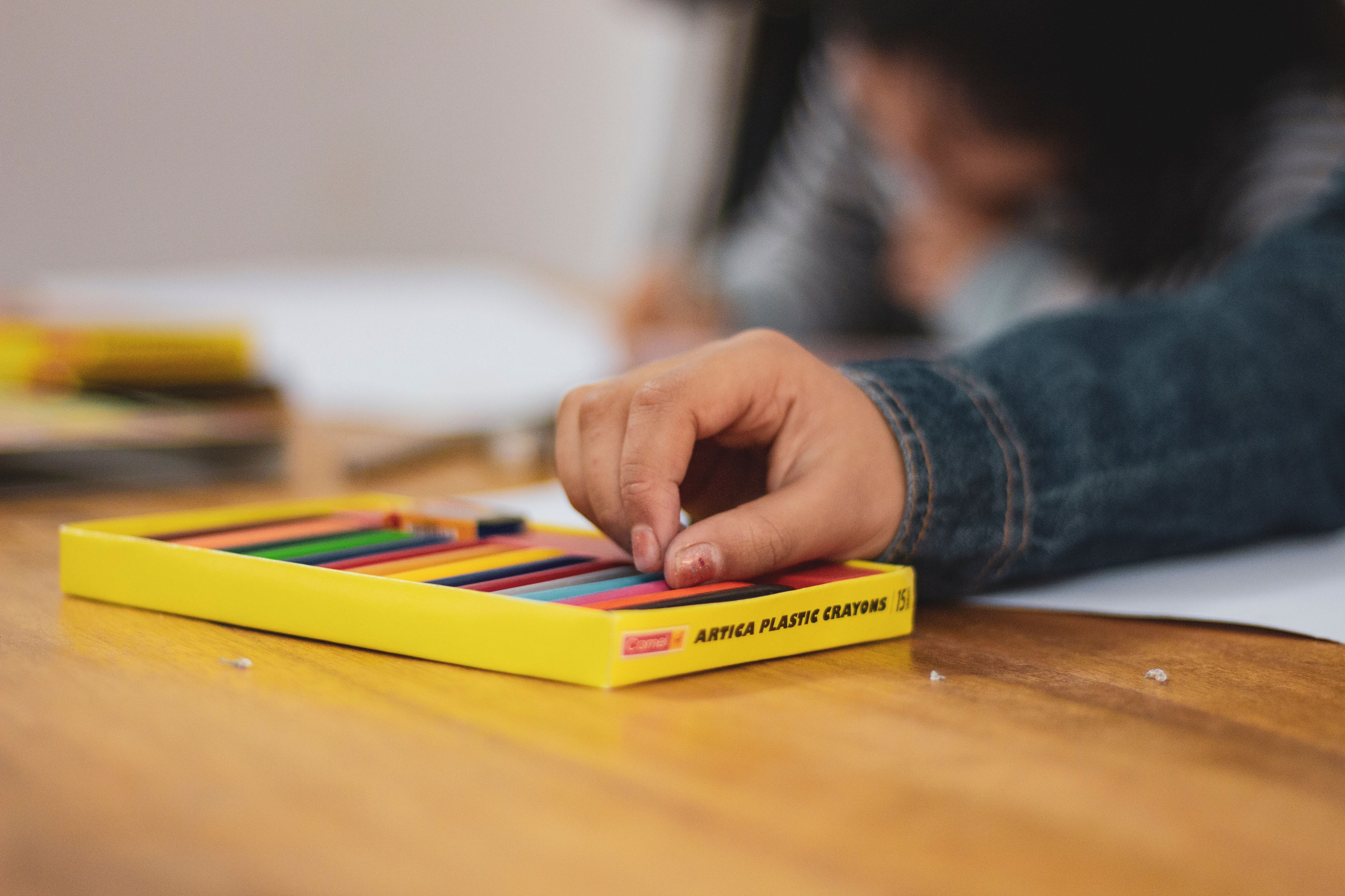 A Boy Writing on the Paper · Free Stock Photo