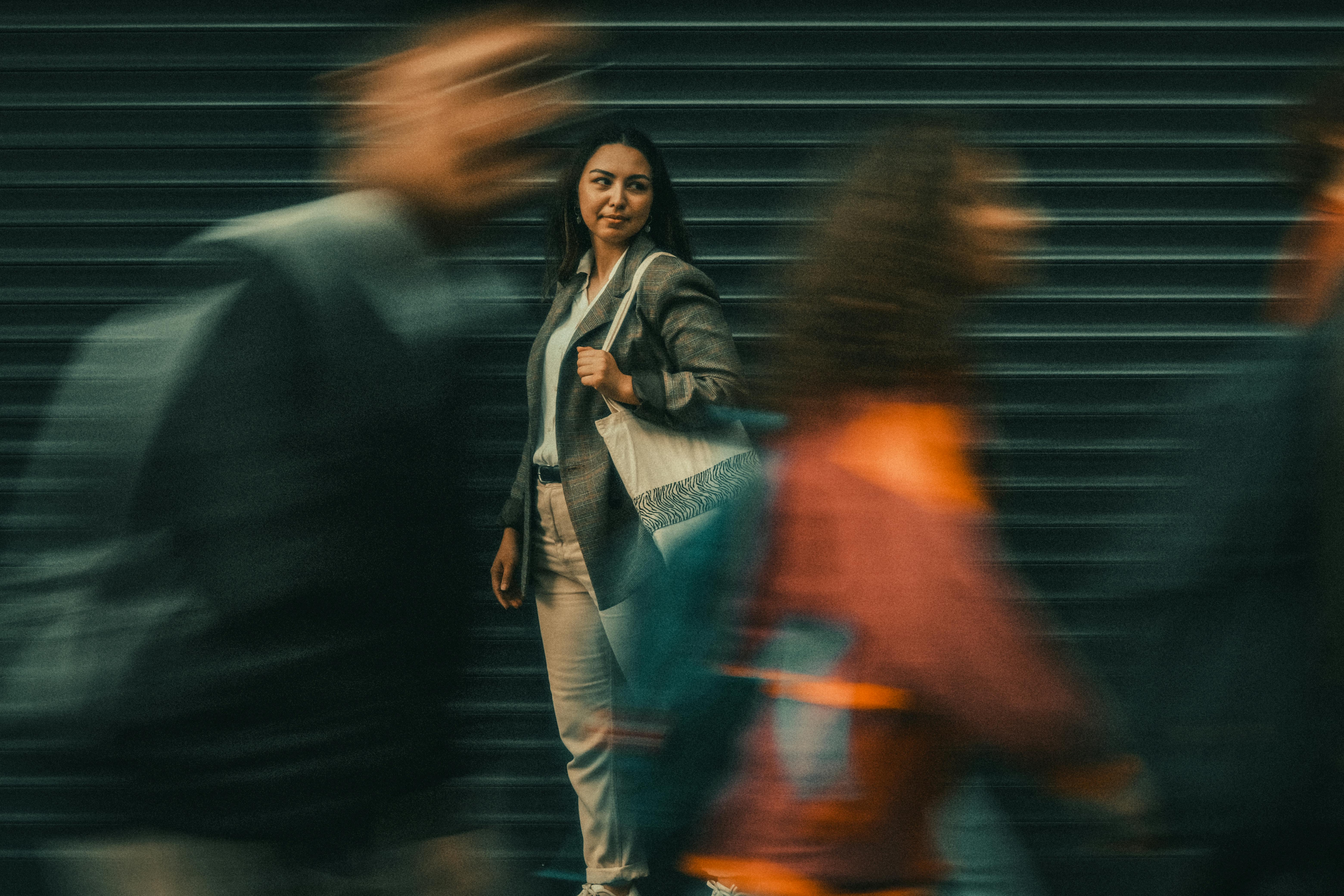 Pedestrians Passing by Woman Standing on Street · Free Stock Photo