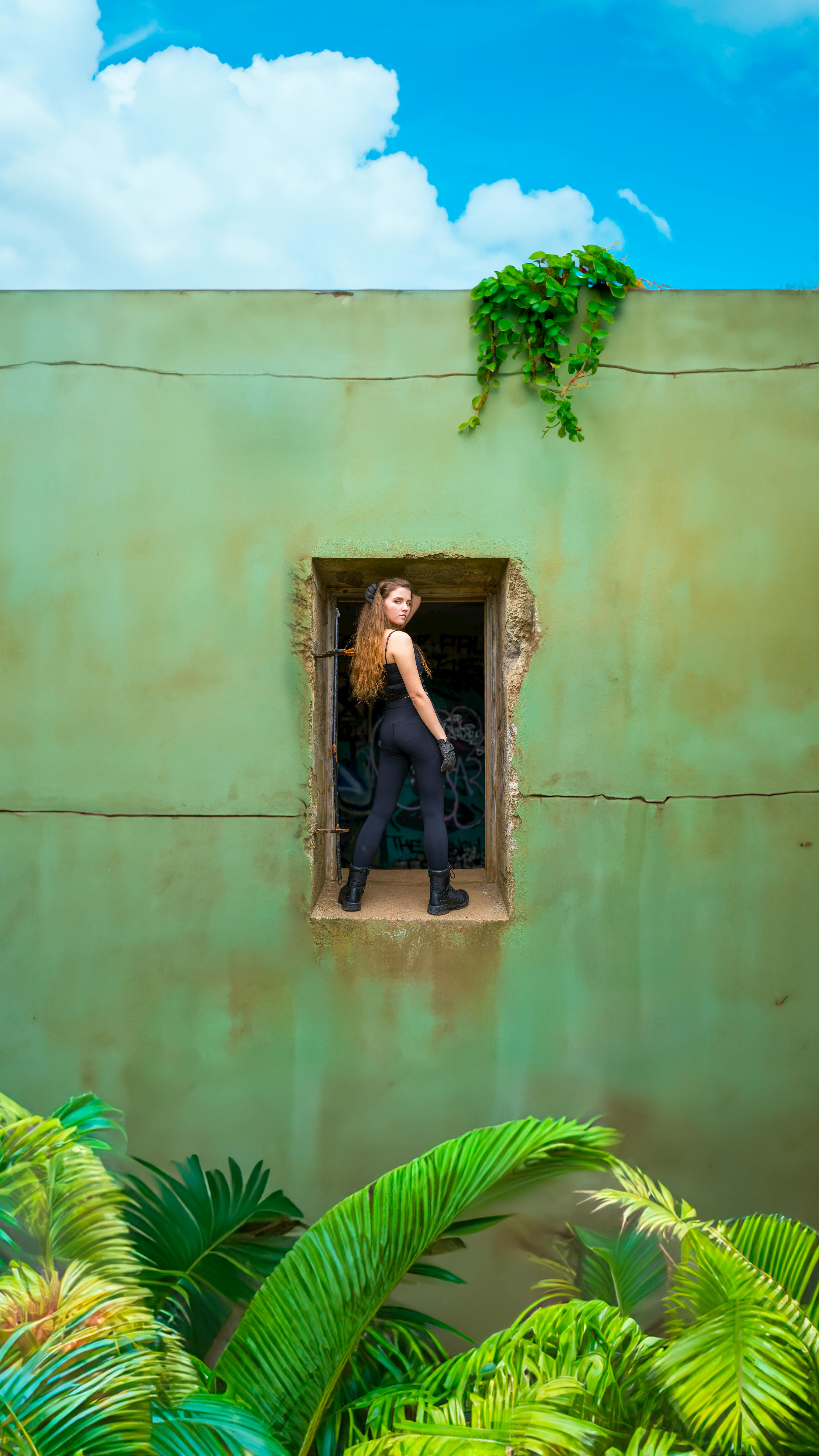 Lara Croft Cosplay Platforming in Jungle Setting · Free Stock Photo