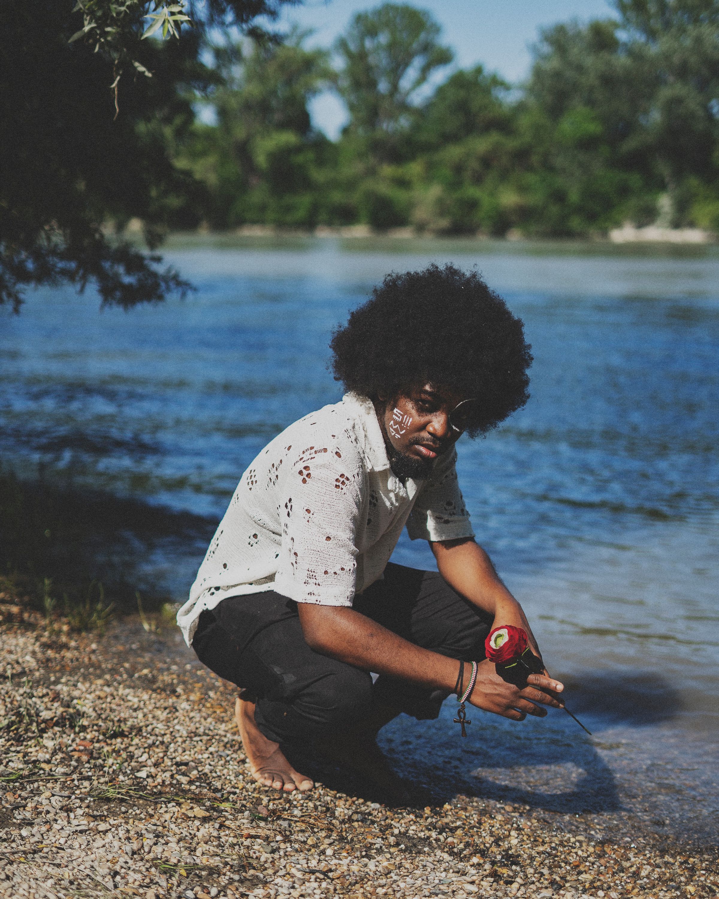Model in Shirt Posing by River · Free Stock Photo
