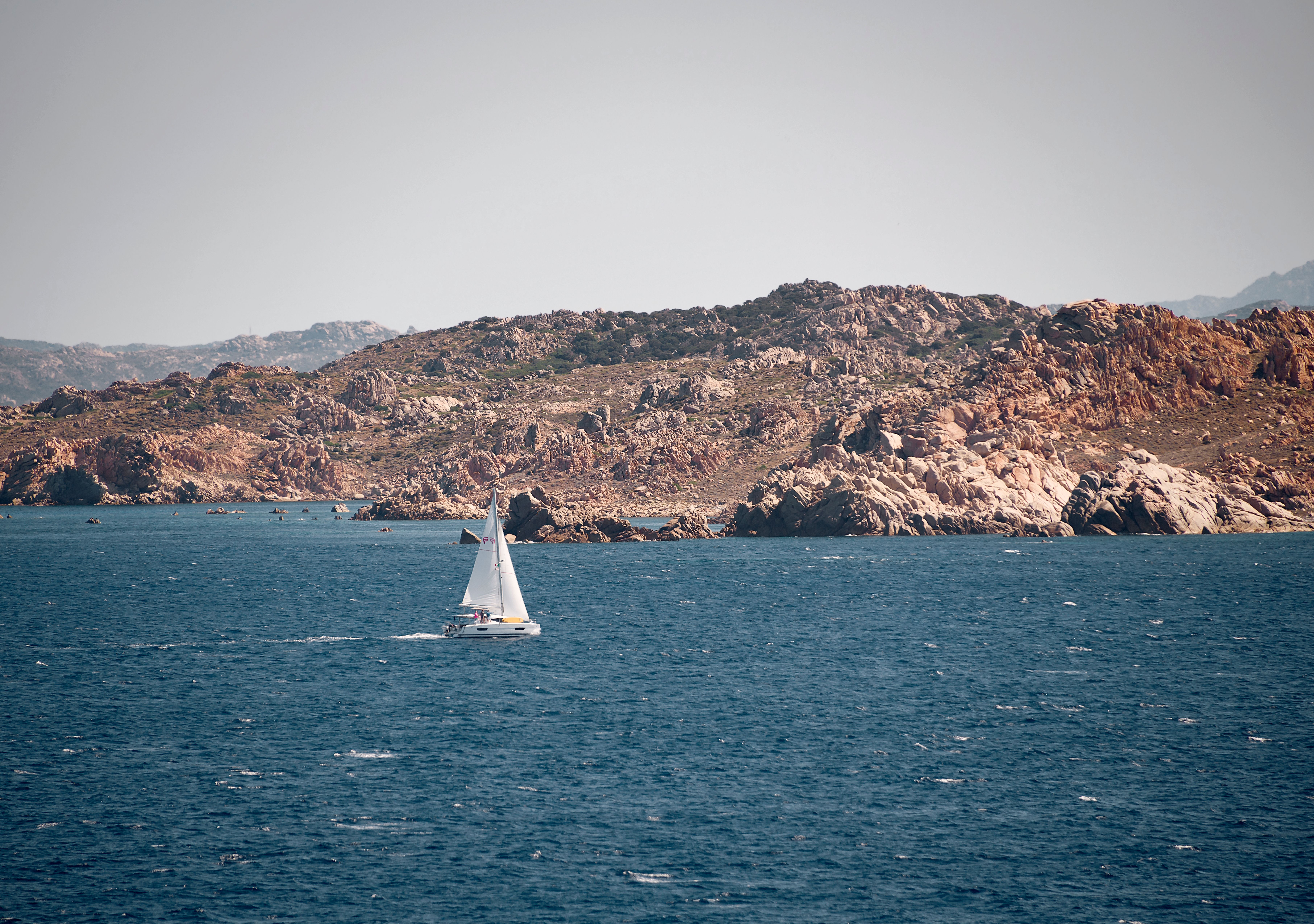 Sailboat near Sea Coast · Free Stock Photo