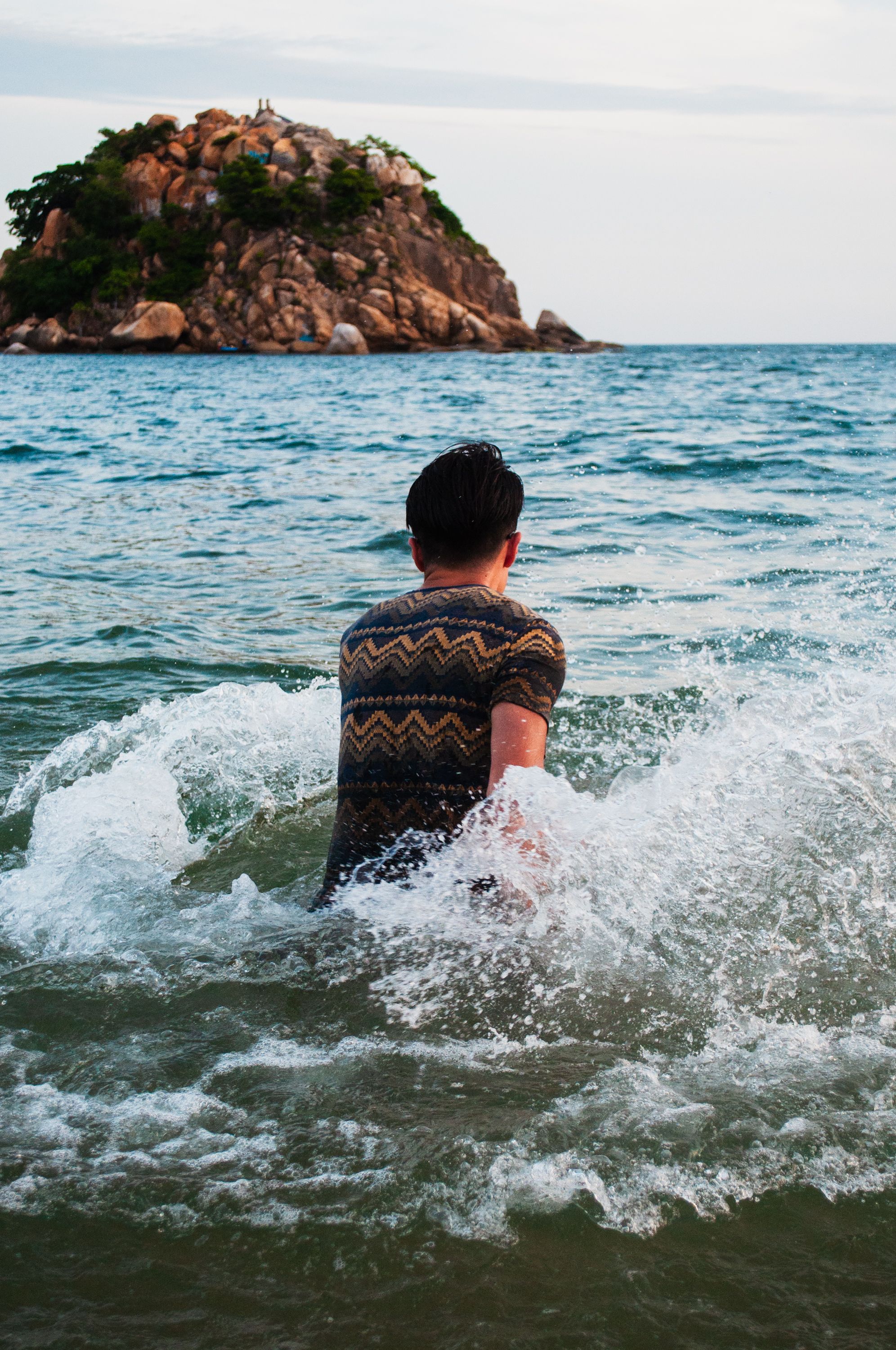 Man Splashing Water on Sea Shore · Free Stock Photo