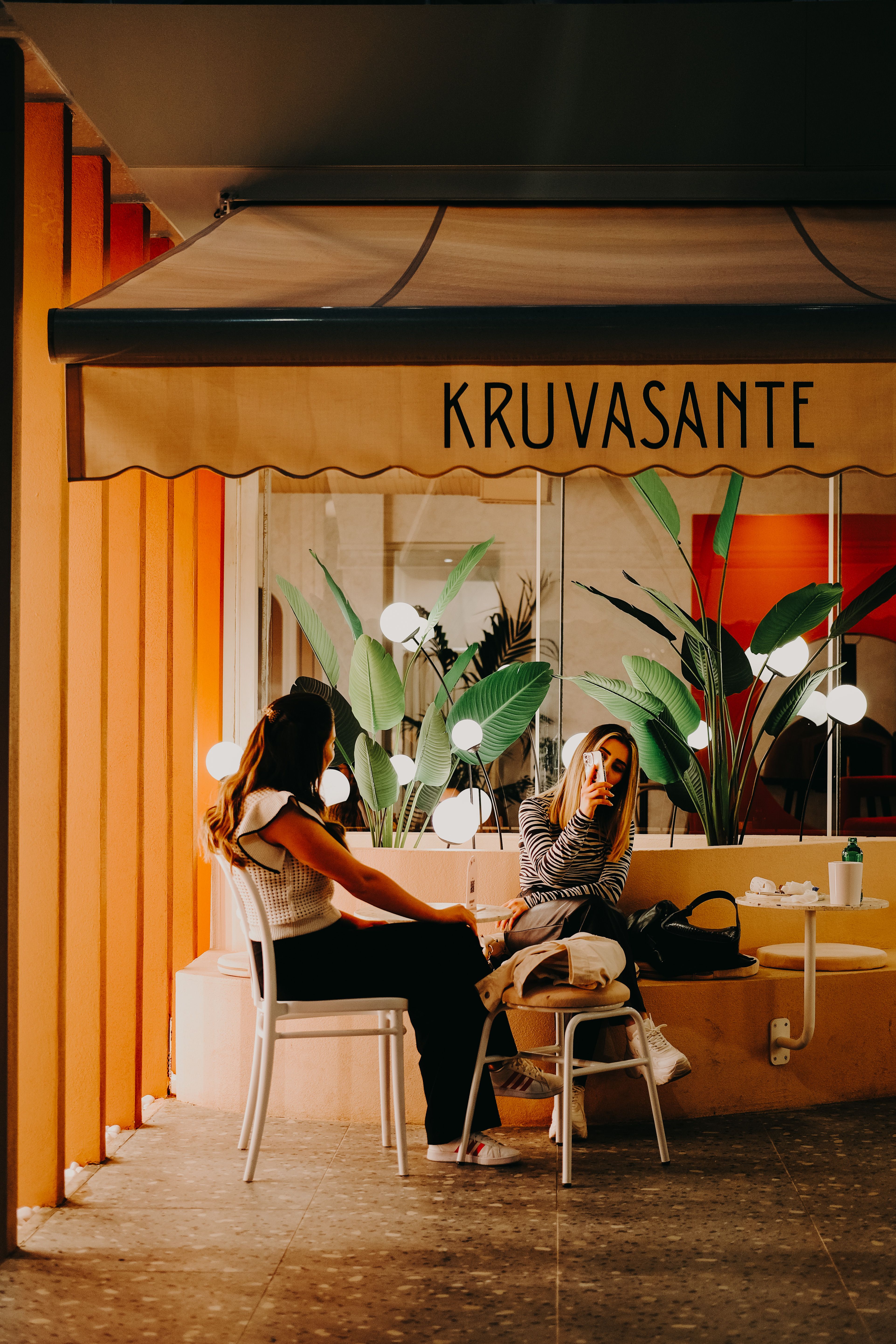 Two Women Sitting in a Cafeteria · Free Stock Photo