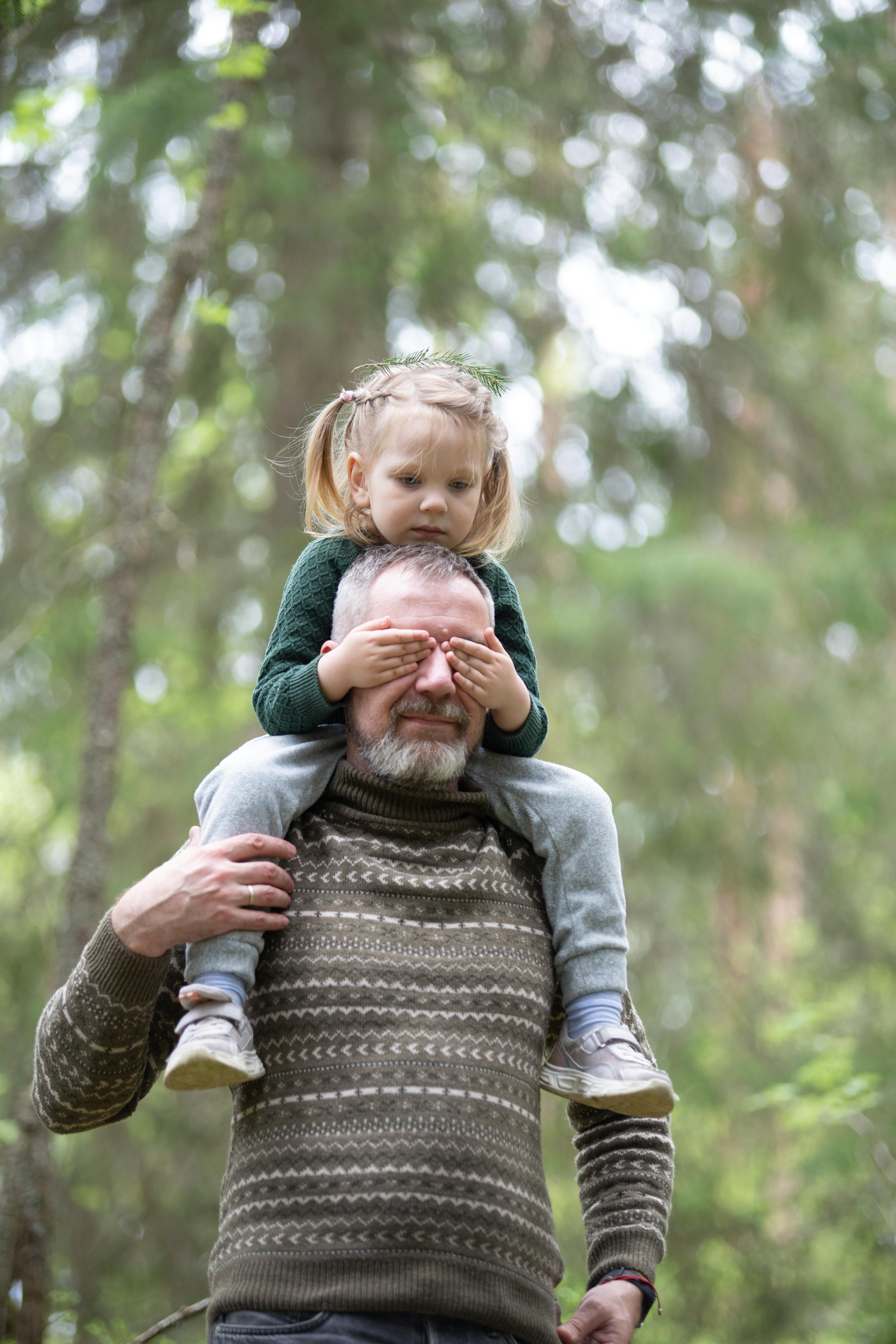 Portrait of Father Holding Daughter · Free Stock Photo