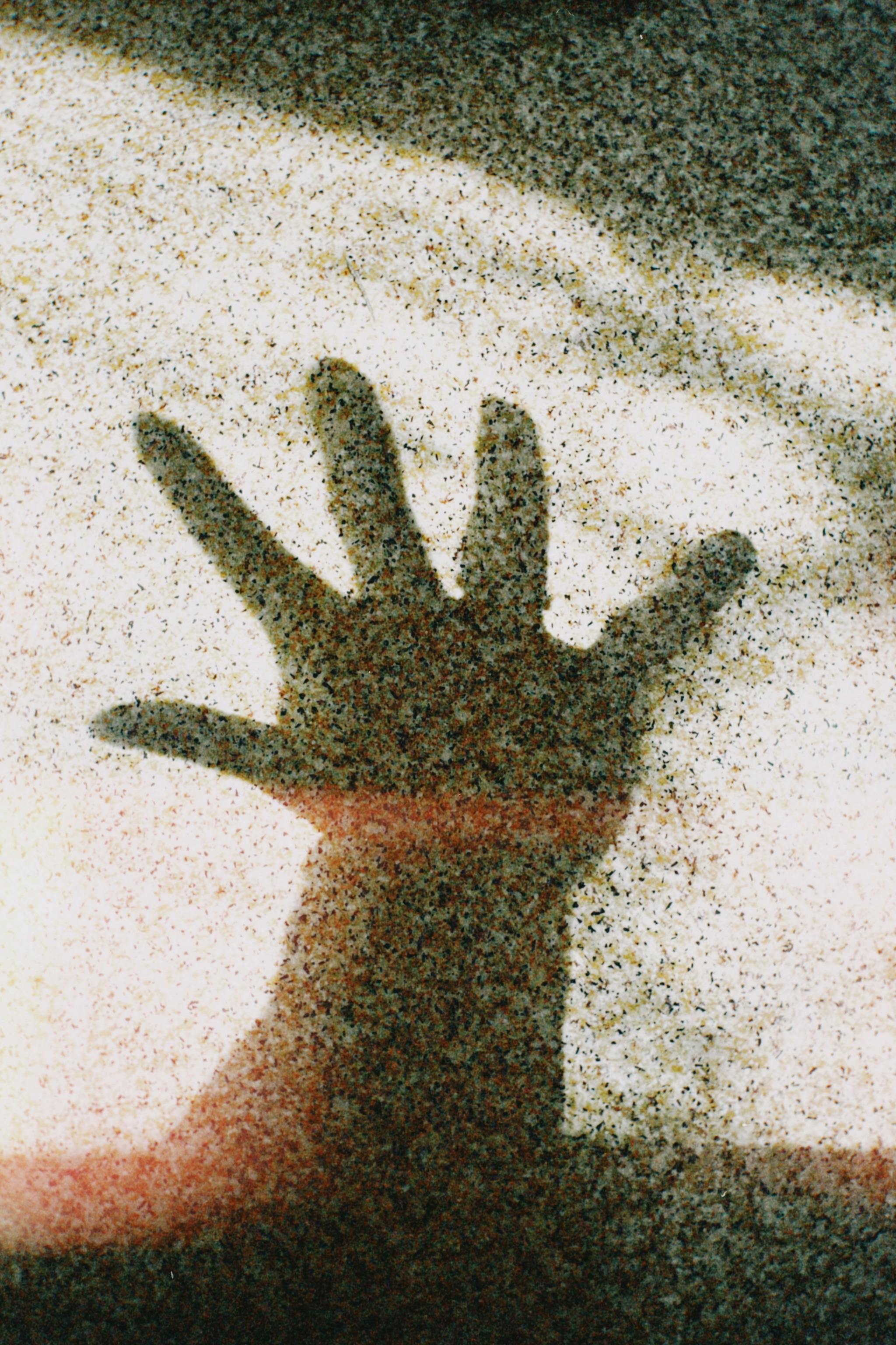 Close-up of Person Hand Shadow on Ground · Free Stock Photo